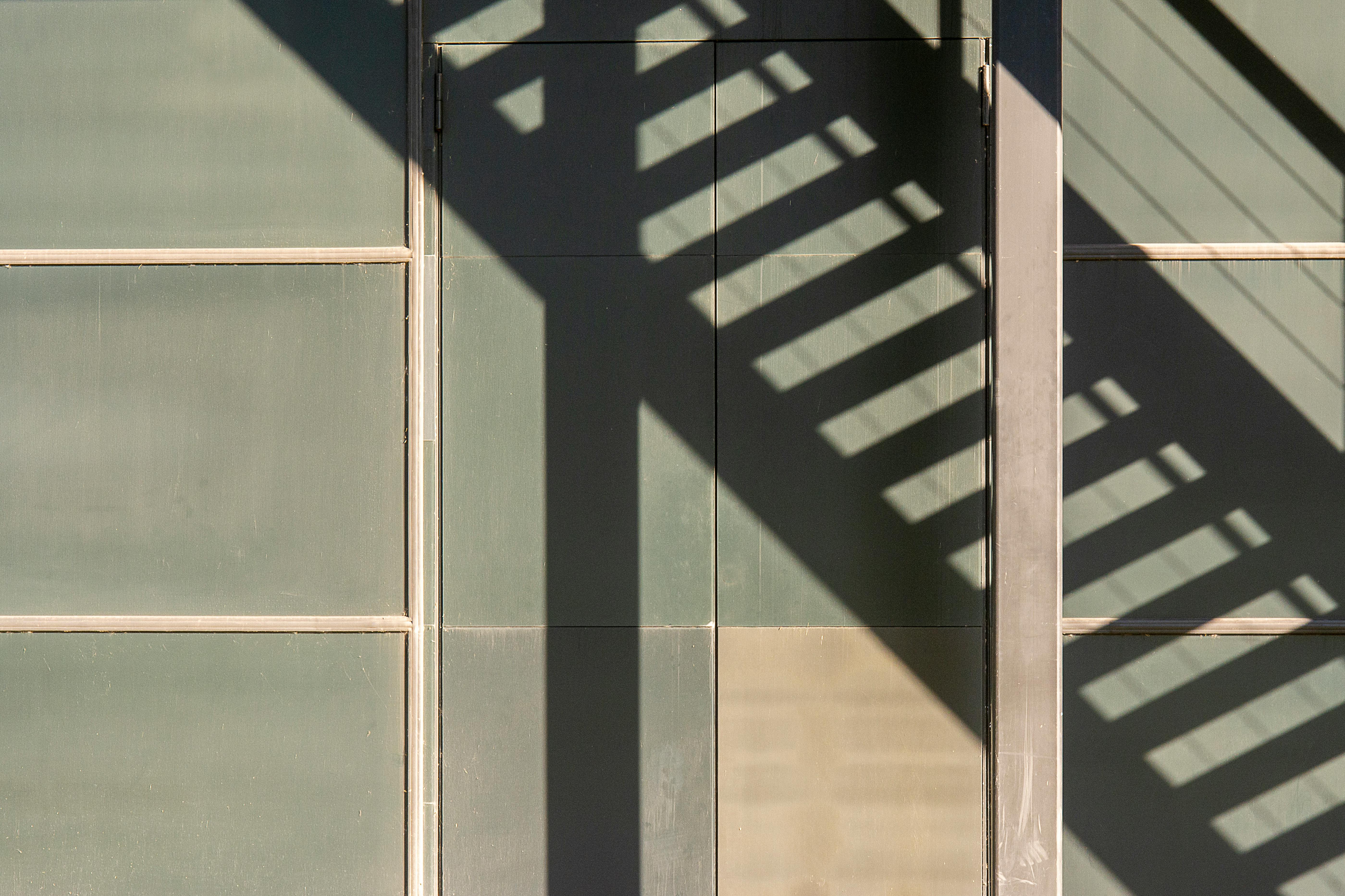 Abstract Shadow Patterns on Modern Wall · Free Stock Photo