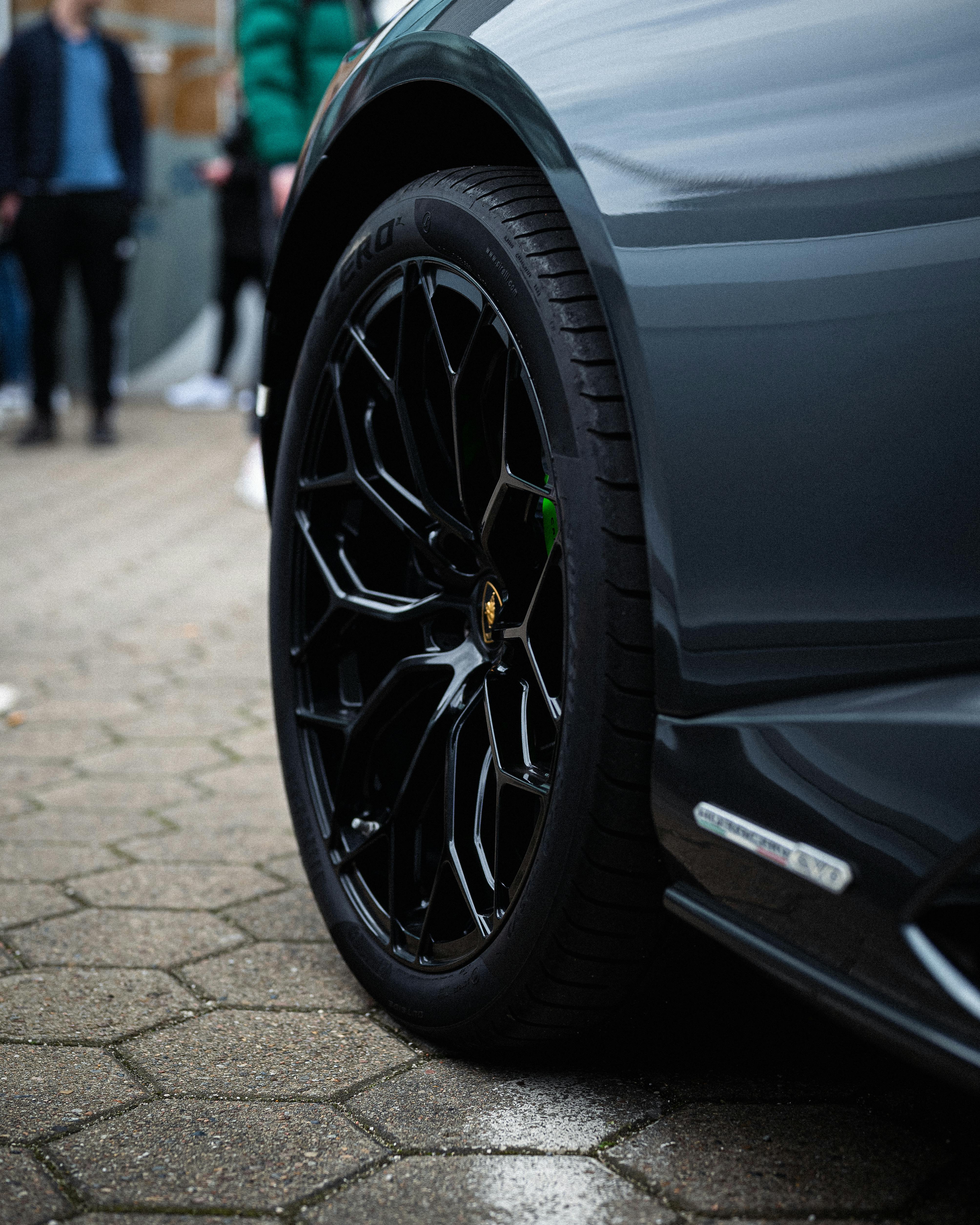 Luxury Lamborghini Wheel Detail in Urban Setting · Free Stock Photo
