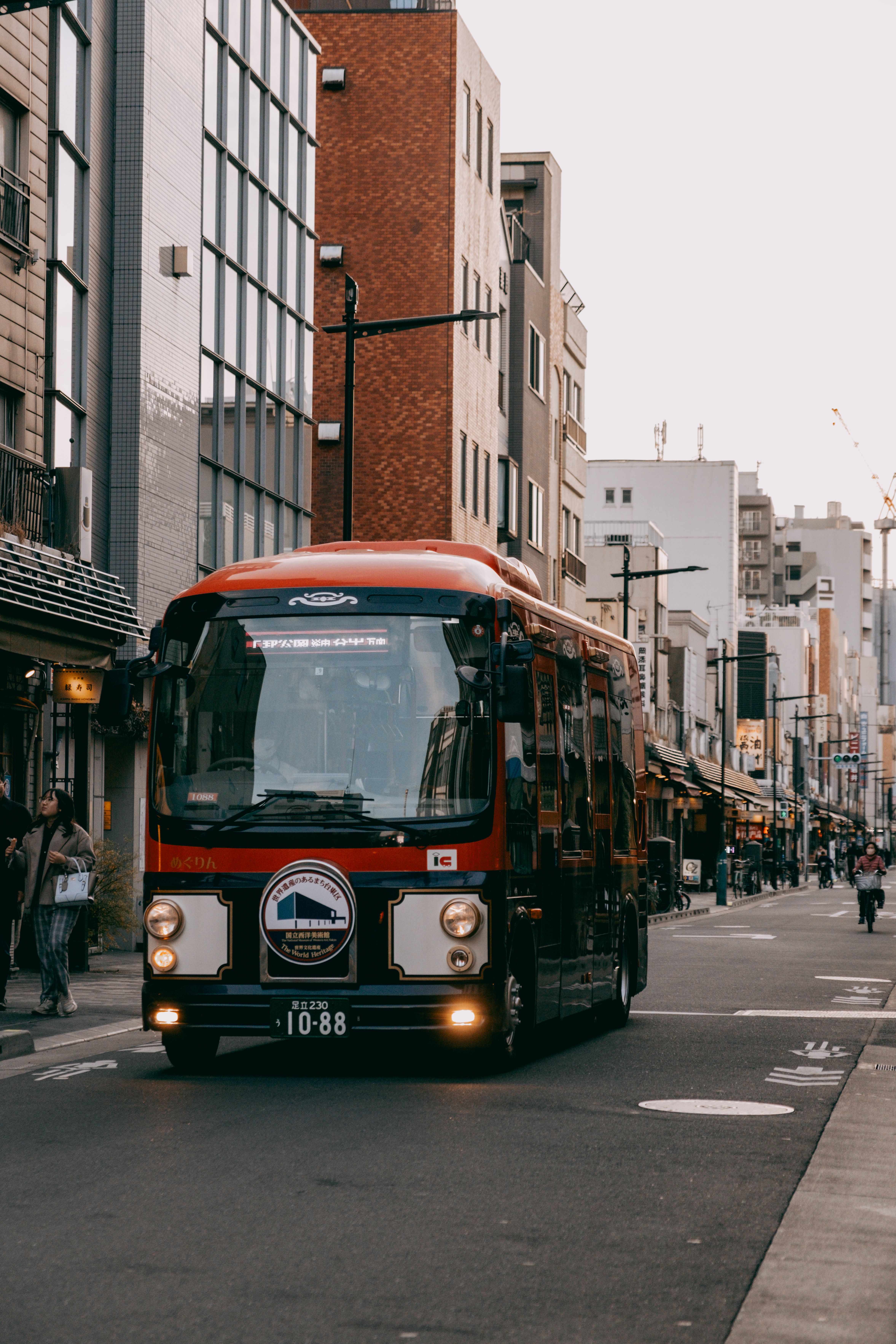City Bus Operating in Tokyo Street at Dusk · Free Stock Photo