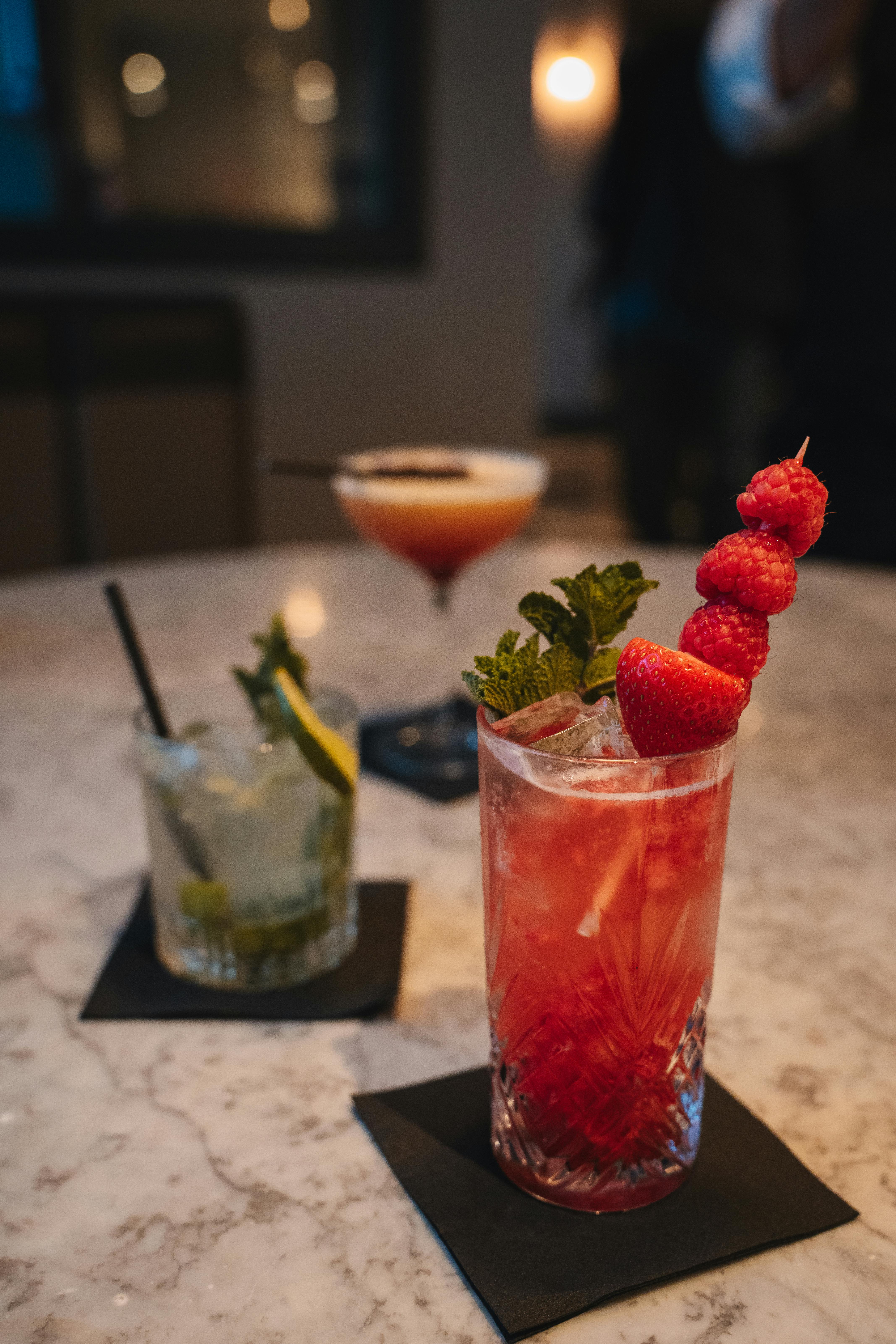Elegant Cocktail Display on Marble Table · Free Stock Photo
