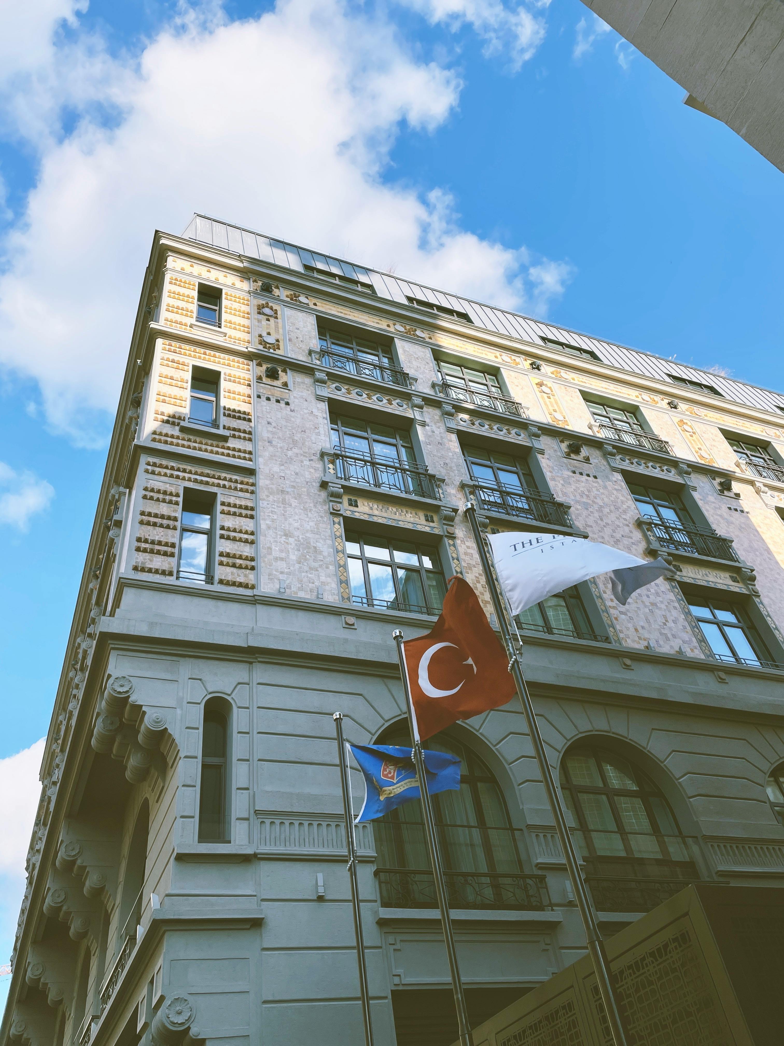 Historic Building with Turkish Flag in Cityscape · Free Stock Photo
