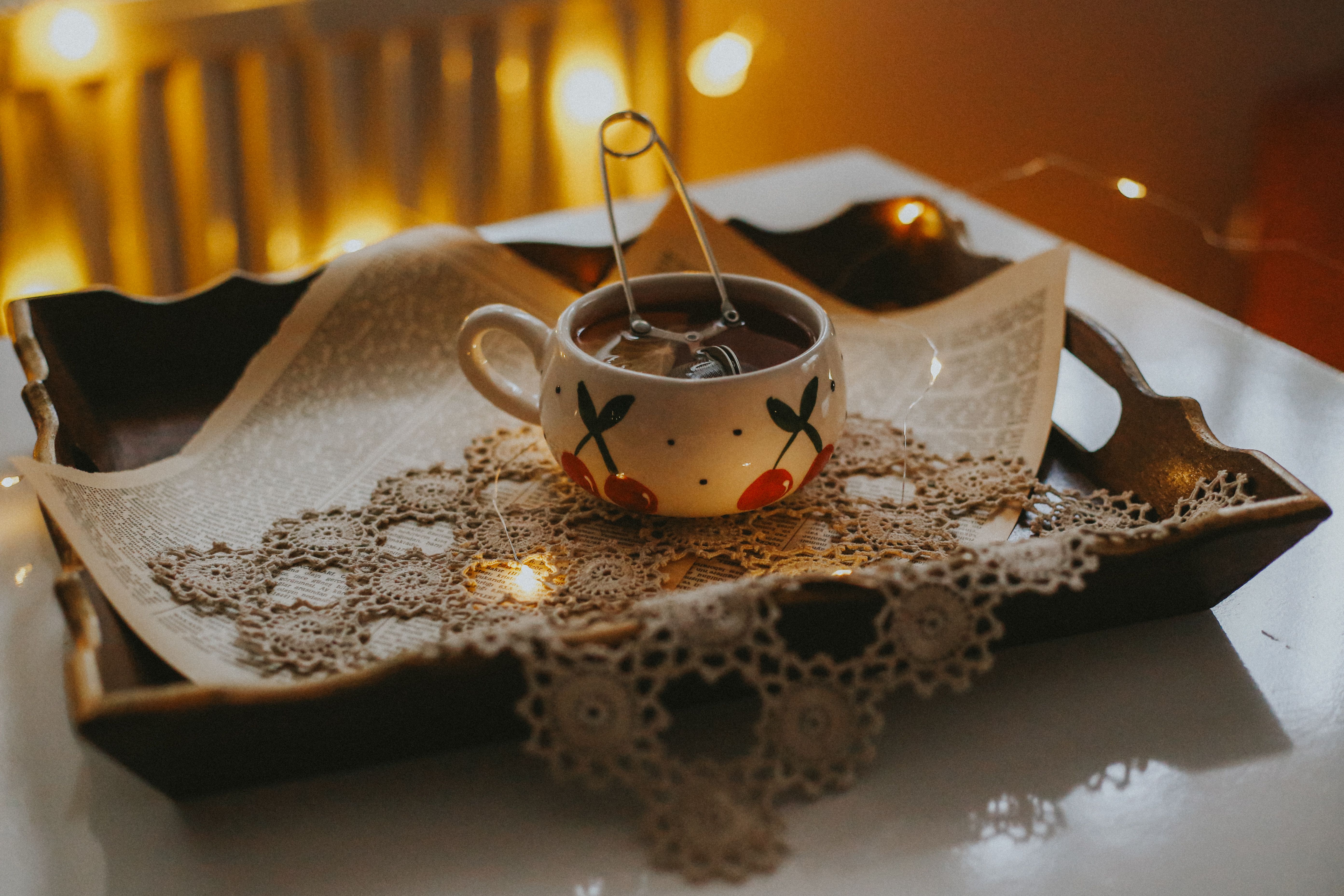 Cozy Tea Setting with Lace and Warm Lighting · Free Stock Photo