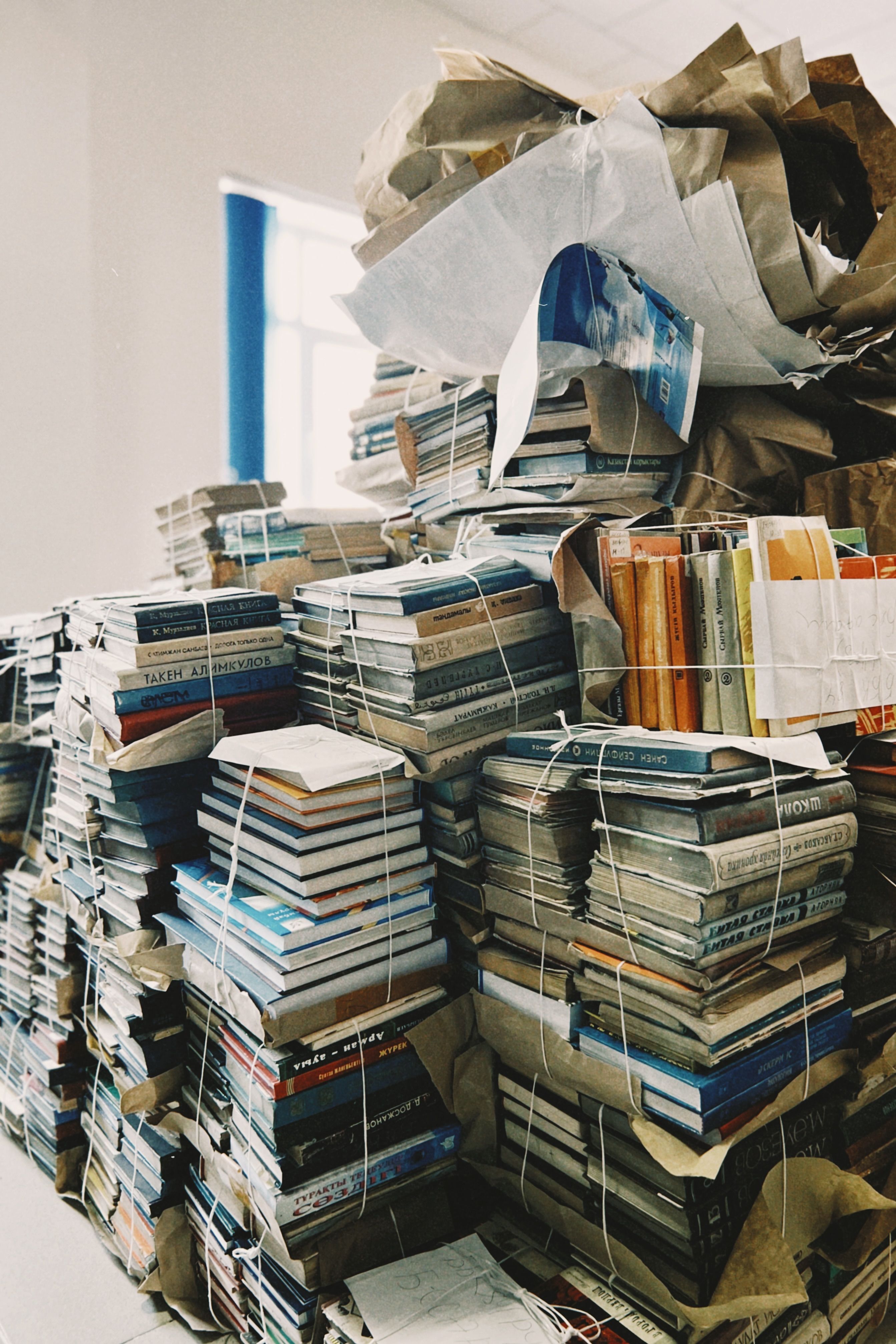 Bundled Books Stacked in Library Room · Free Stock Photo