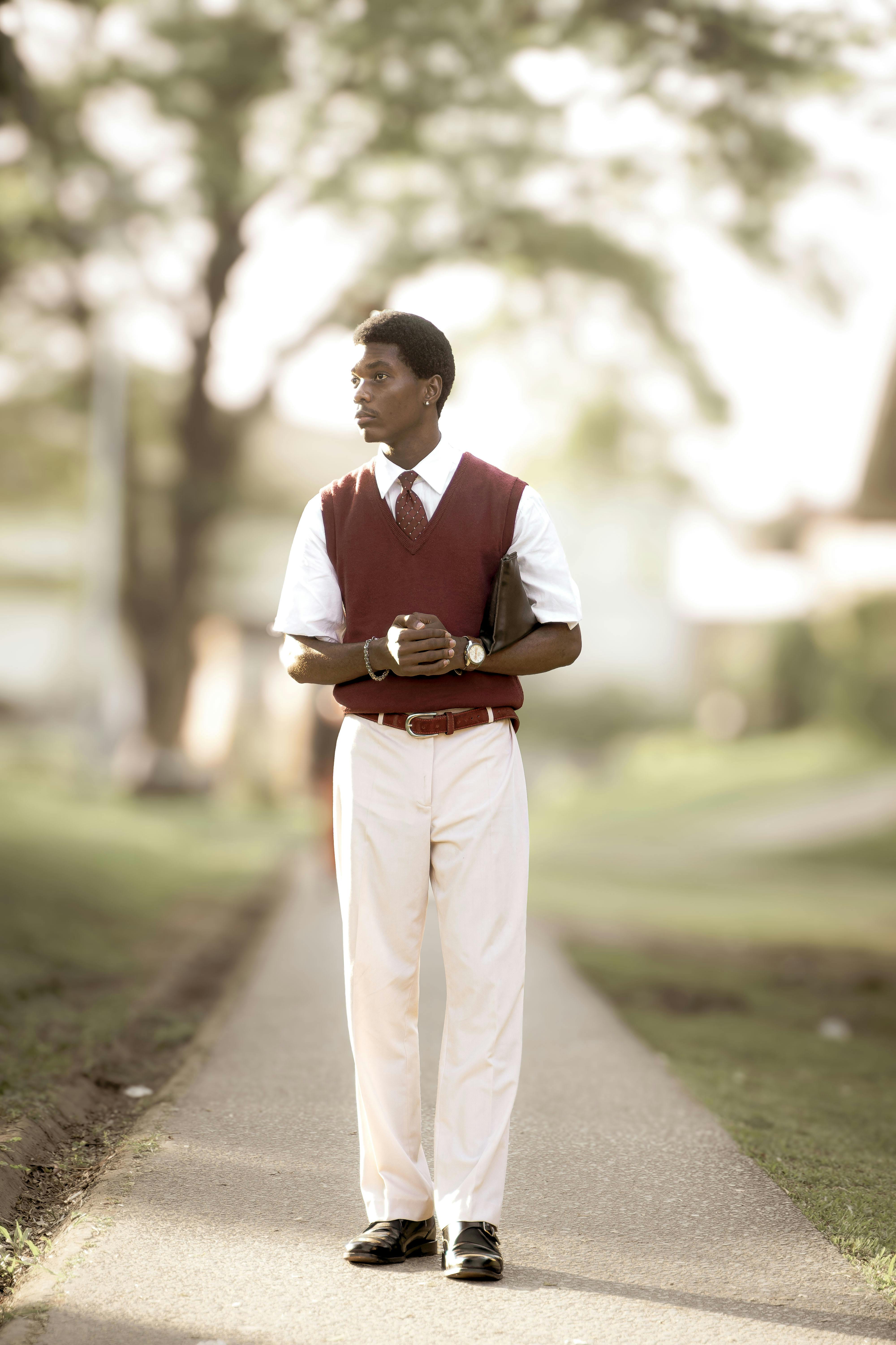 Elegant Man Walking on Douala Pathway · Free Stock Photo