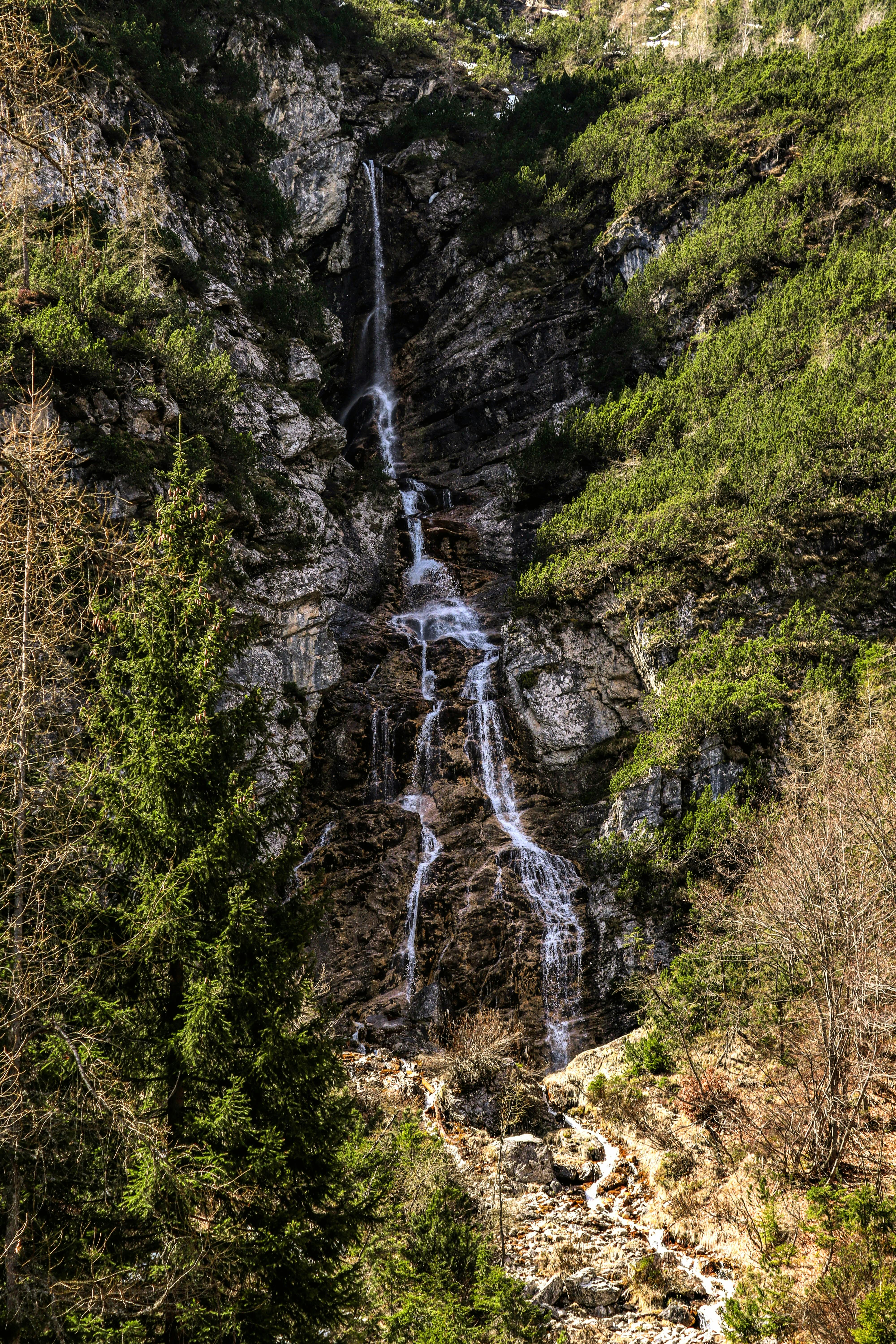 Majestic Waterfall Cascading Down Rocky Cliff · Free Stock Photo