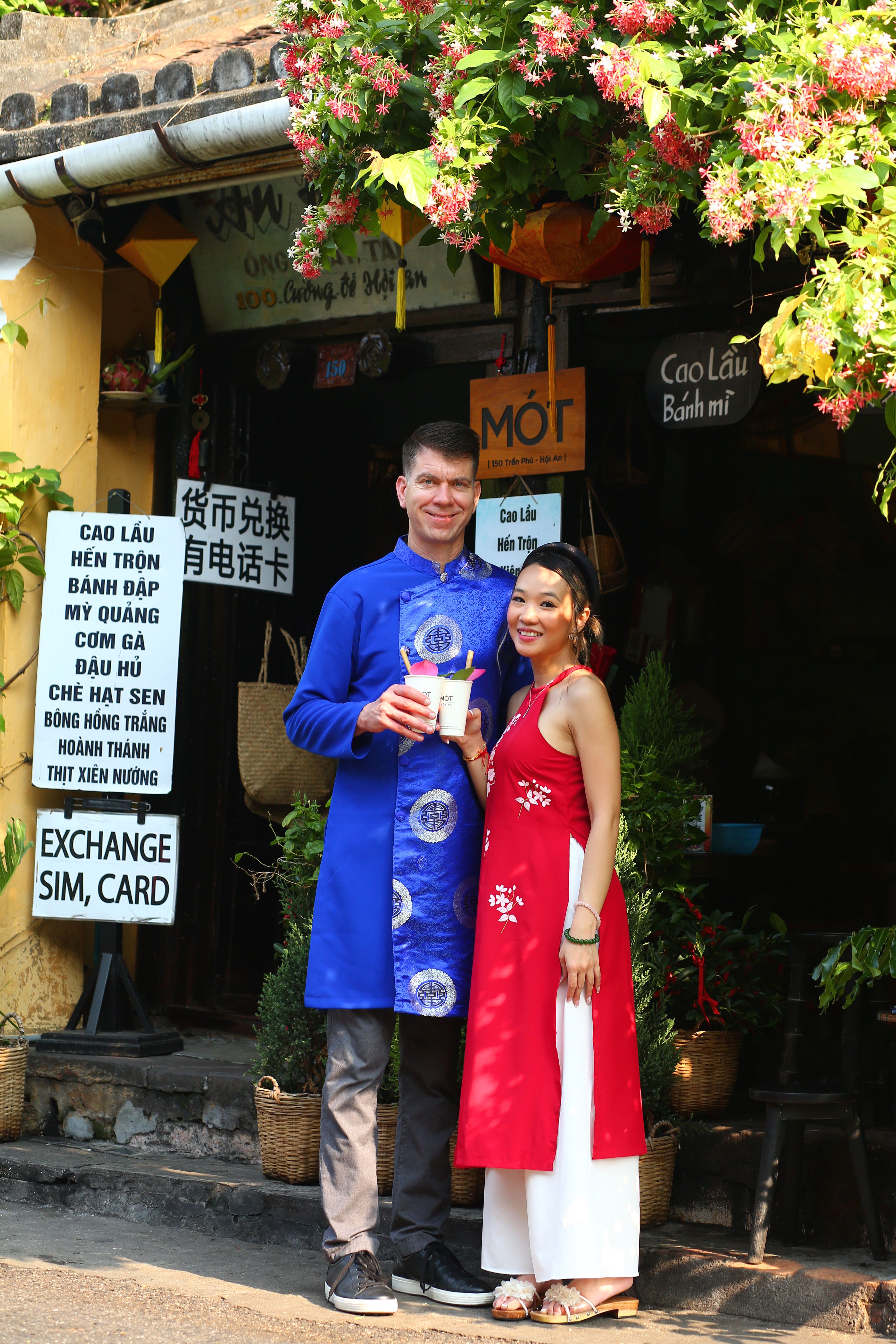 Couple Enjoying Drinks Outside Vietnamese Cafe · Free Stock Photo