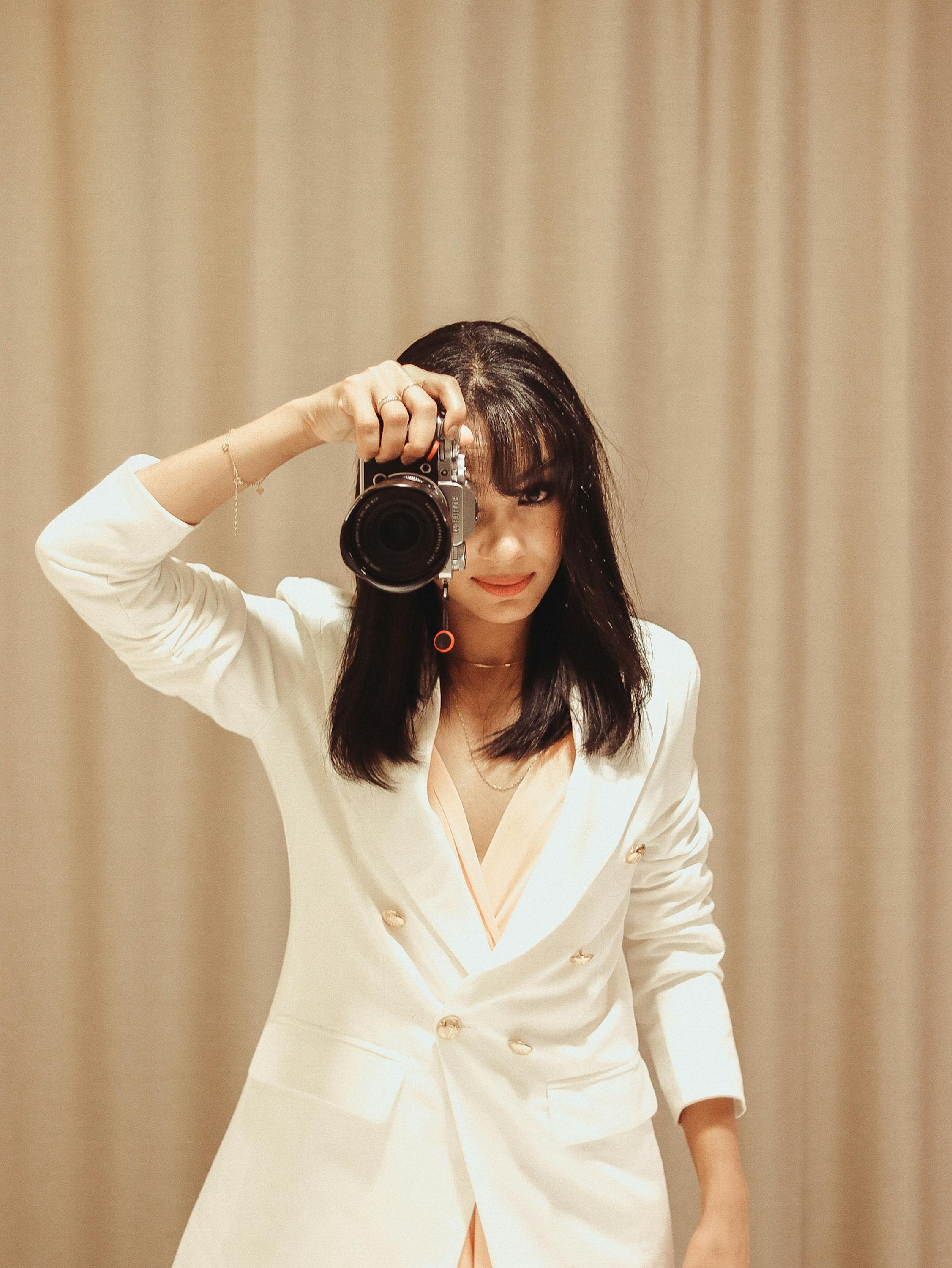 Portrait of a Woman with Vintage Camera · Free Stock Photo