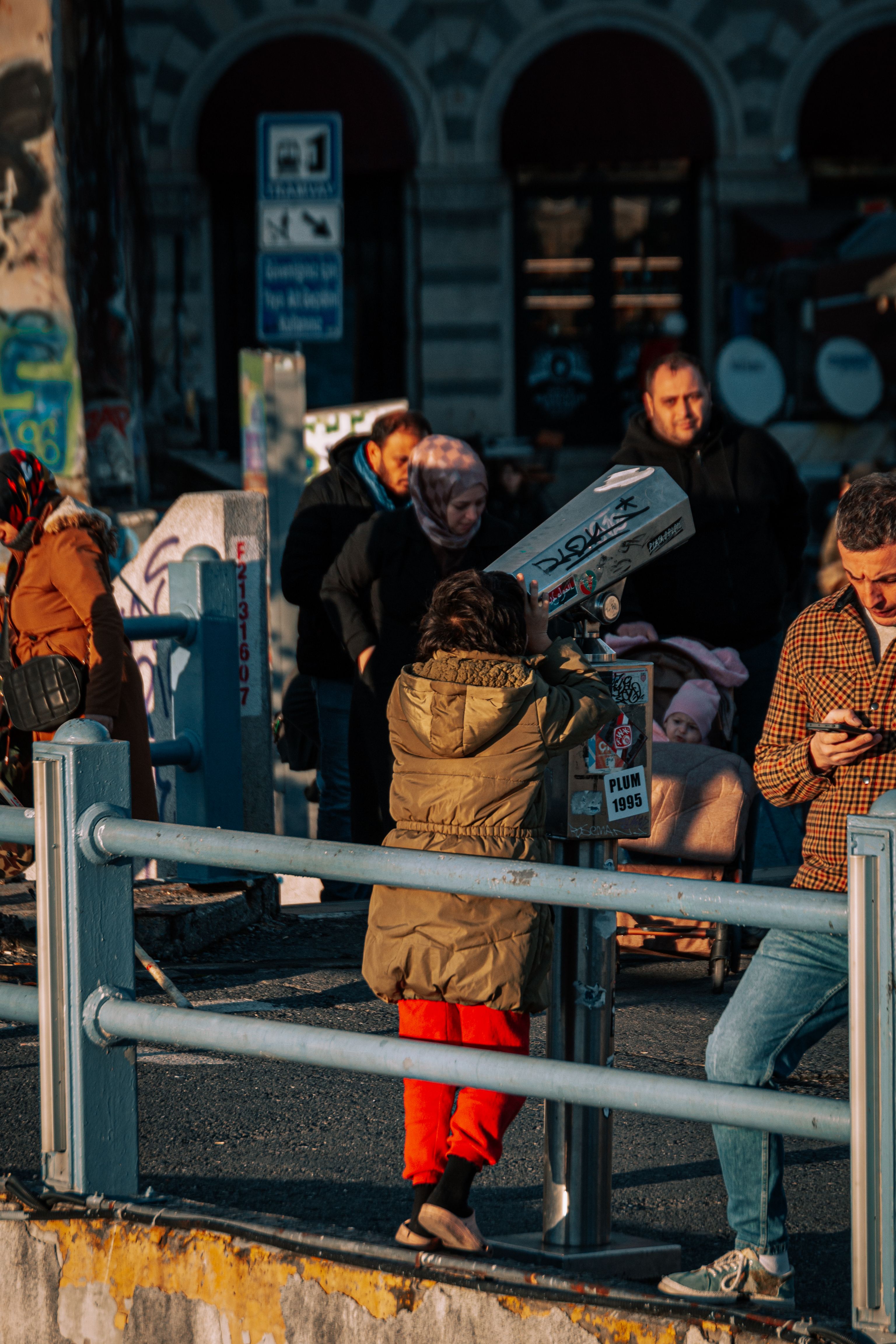 Urban Scene with Public Telescope and Passersby · Free Stock Photo