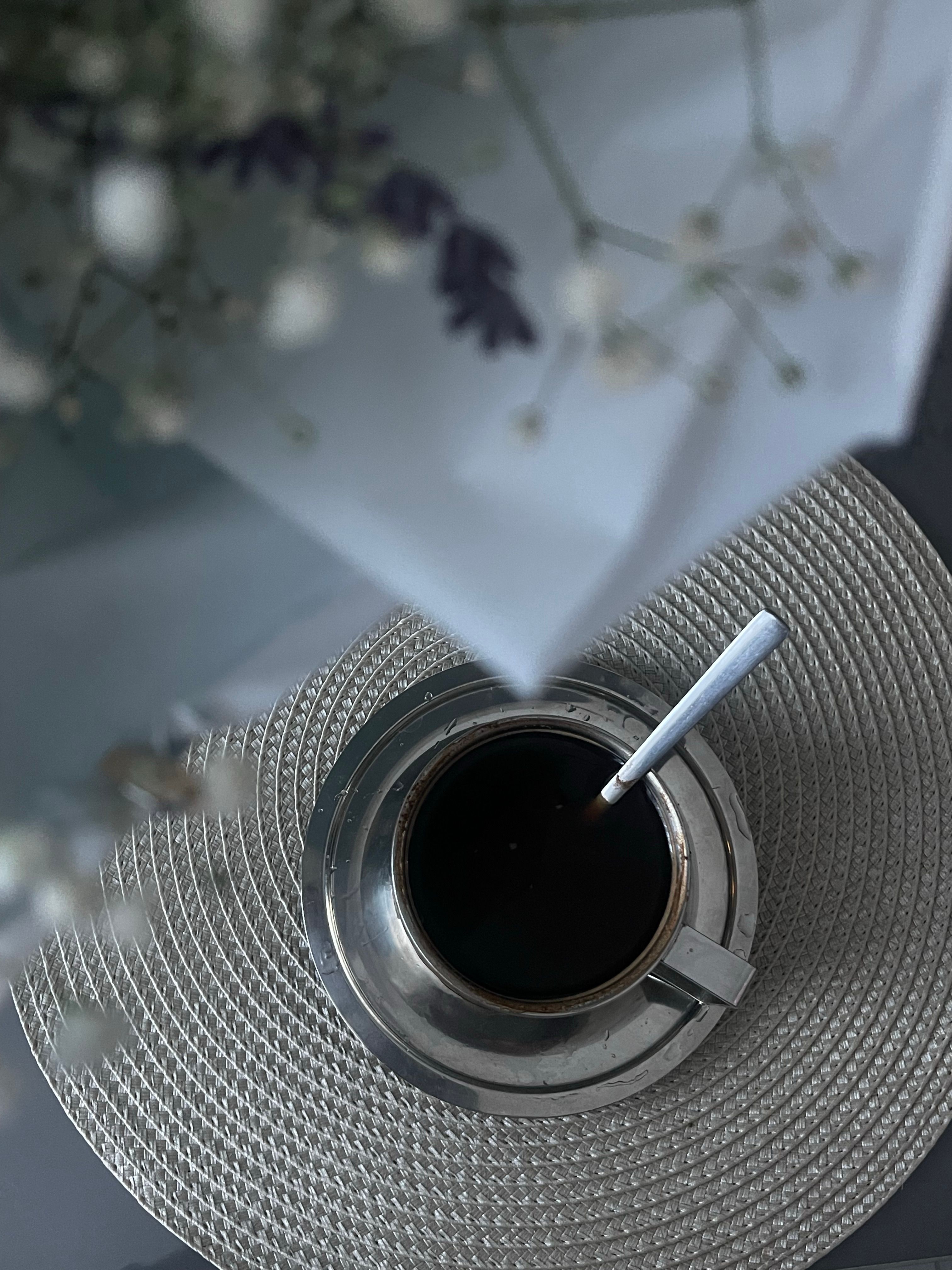 Aesthetic Overhead Coffee Cup Shot on Textured Mat · Free Stock Photo