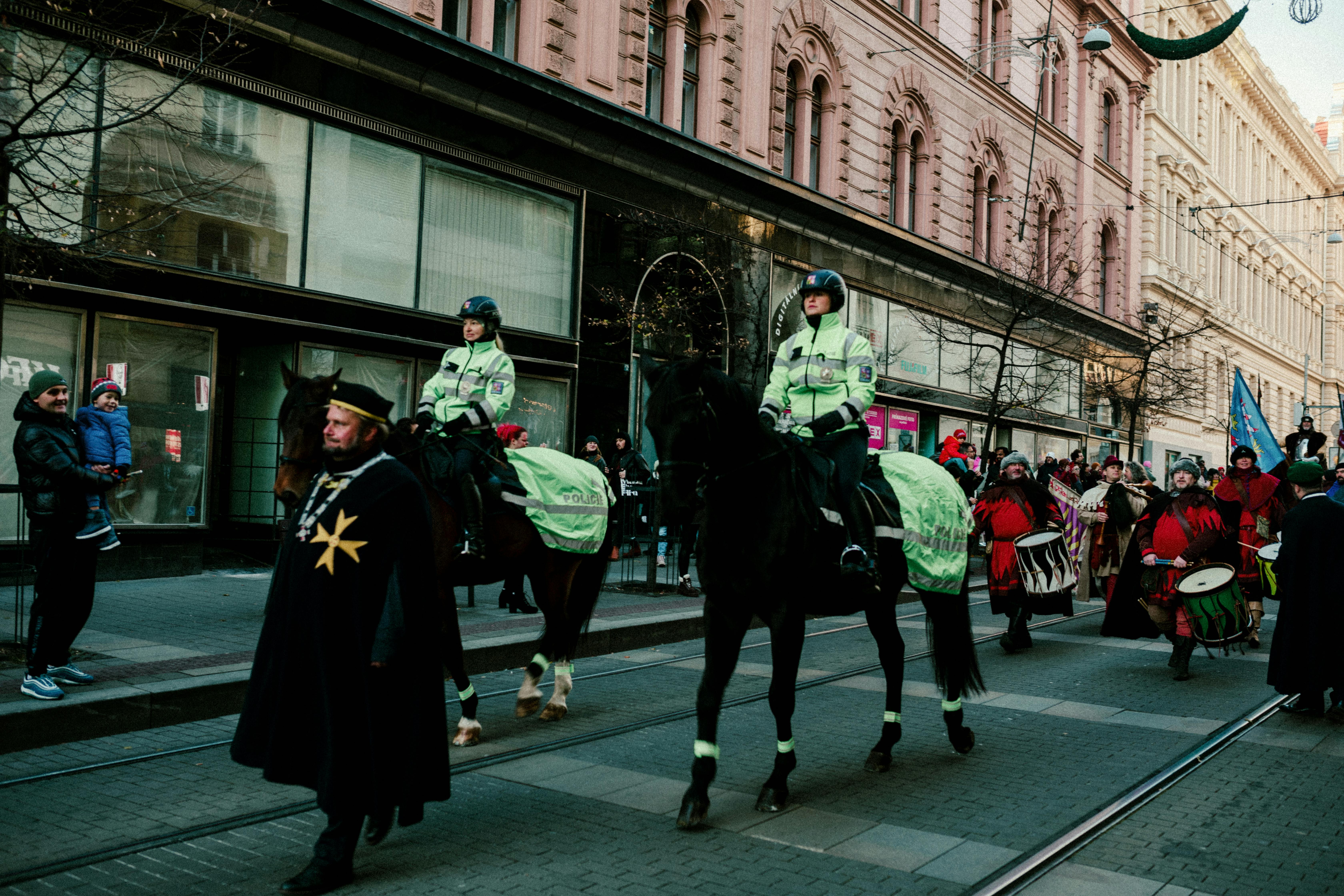 Vibrant Parade with Mounted Police on City Street · Free Stock Photo