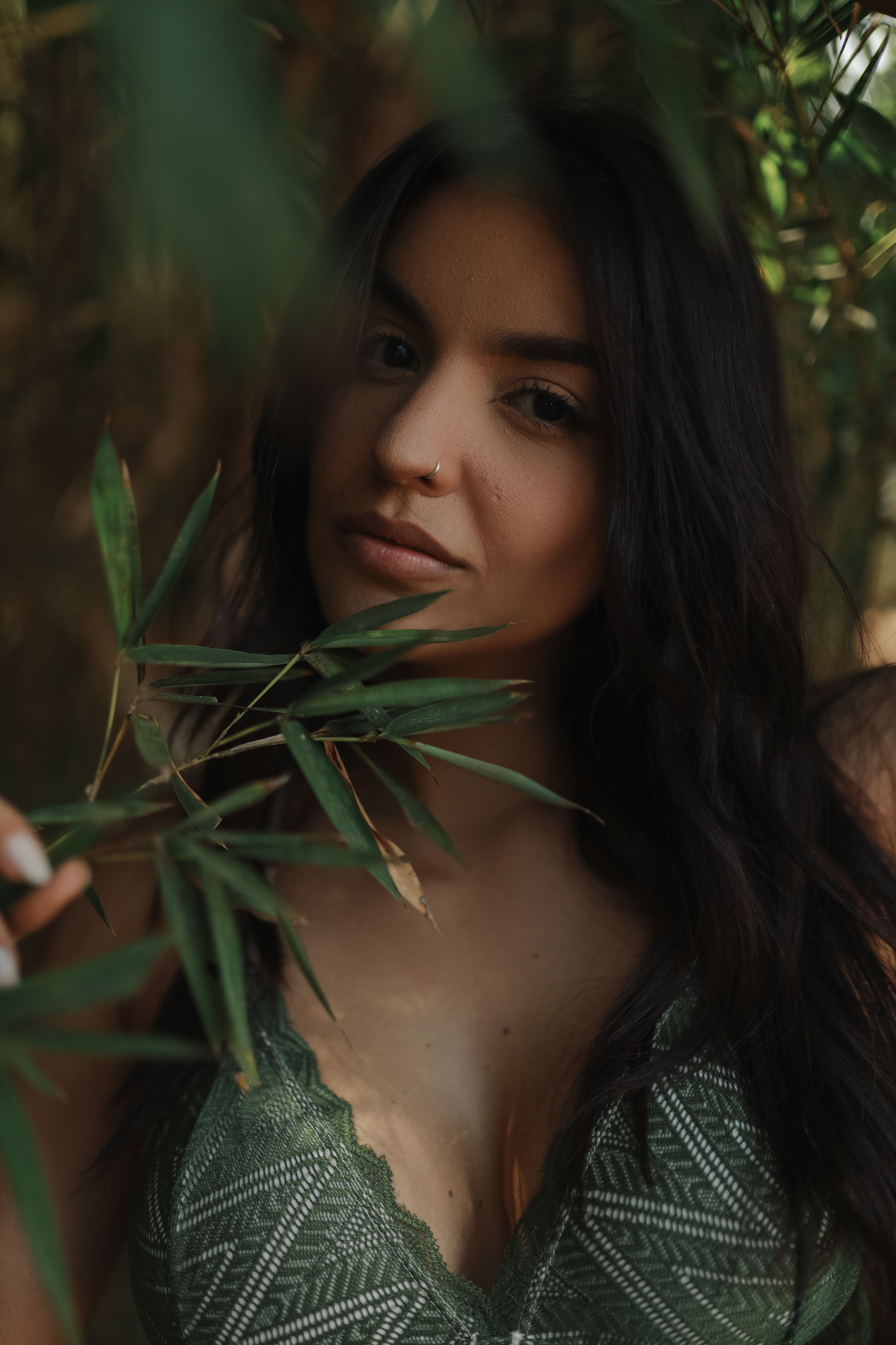 Portrait of Woman with Greenery Outdoors · Free Stock Photo