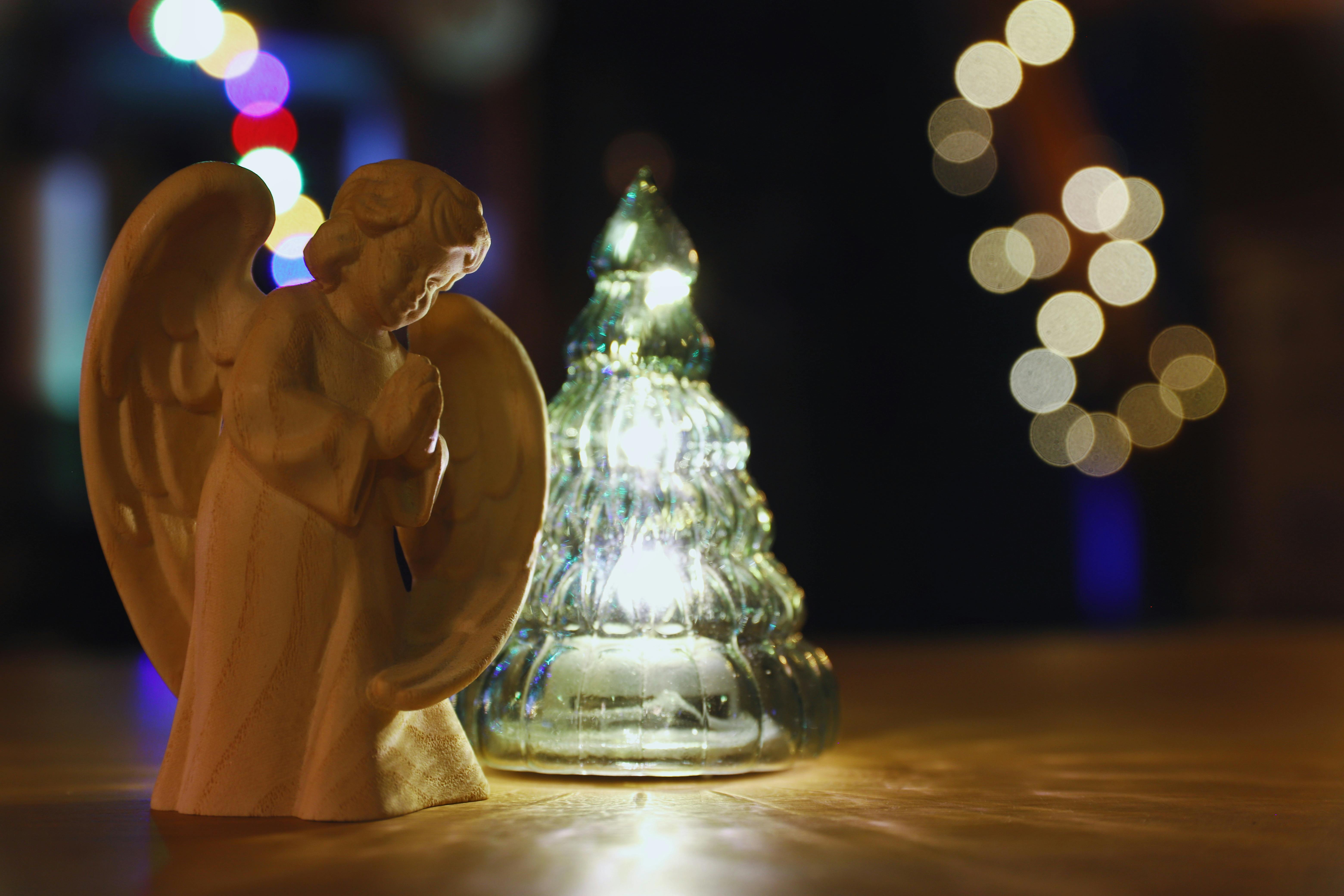 Wooden Angel Figurine with Festive Lights · Free Stock Photo