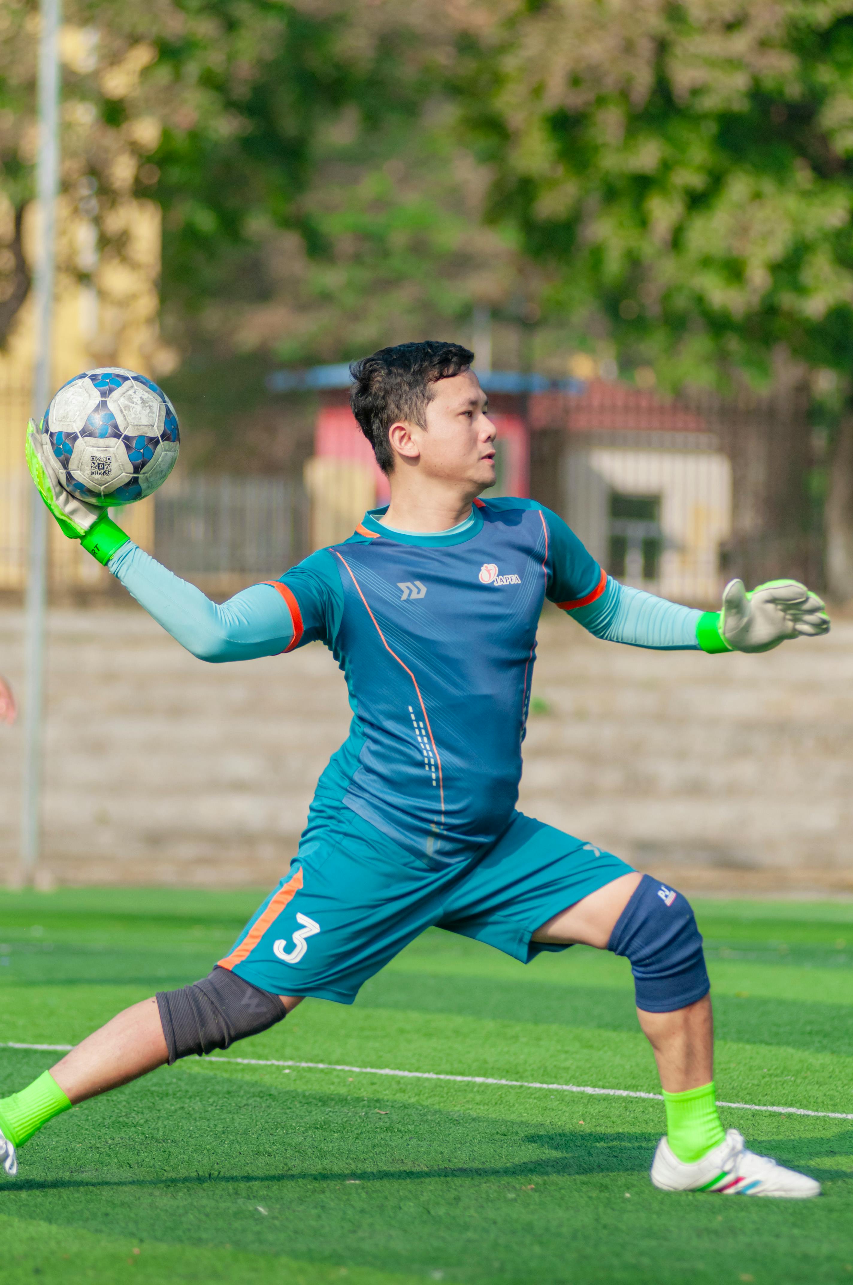 Soccer Goalie in Action at Hanoi Field · Free Stock Photo