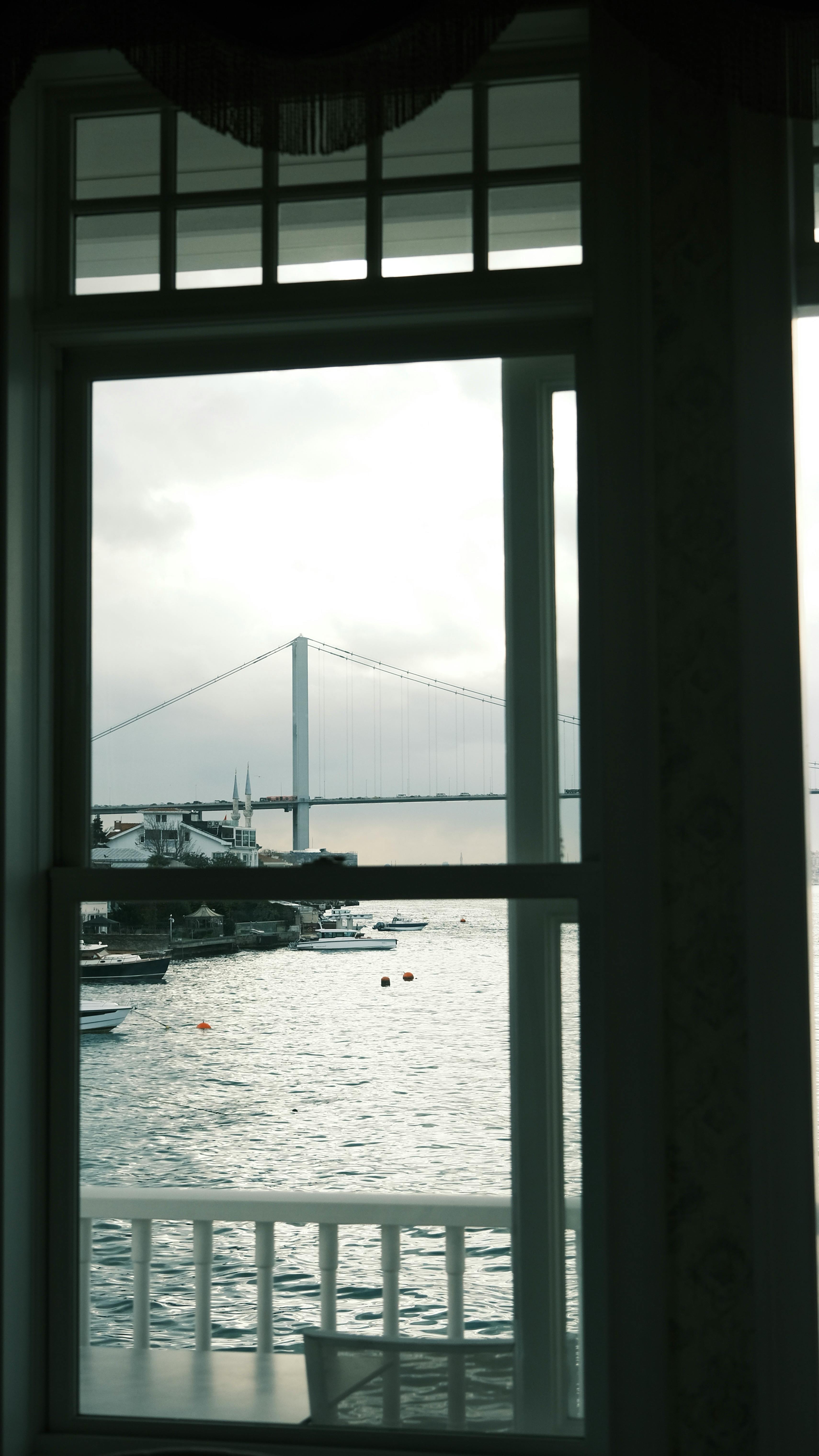 Scenic Bridge View Through Window Frame · Free Stock Photo
