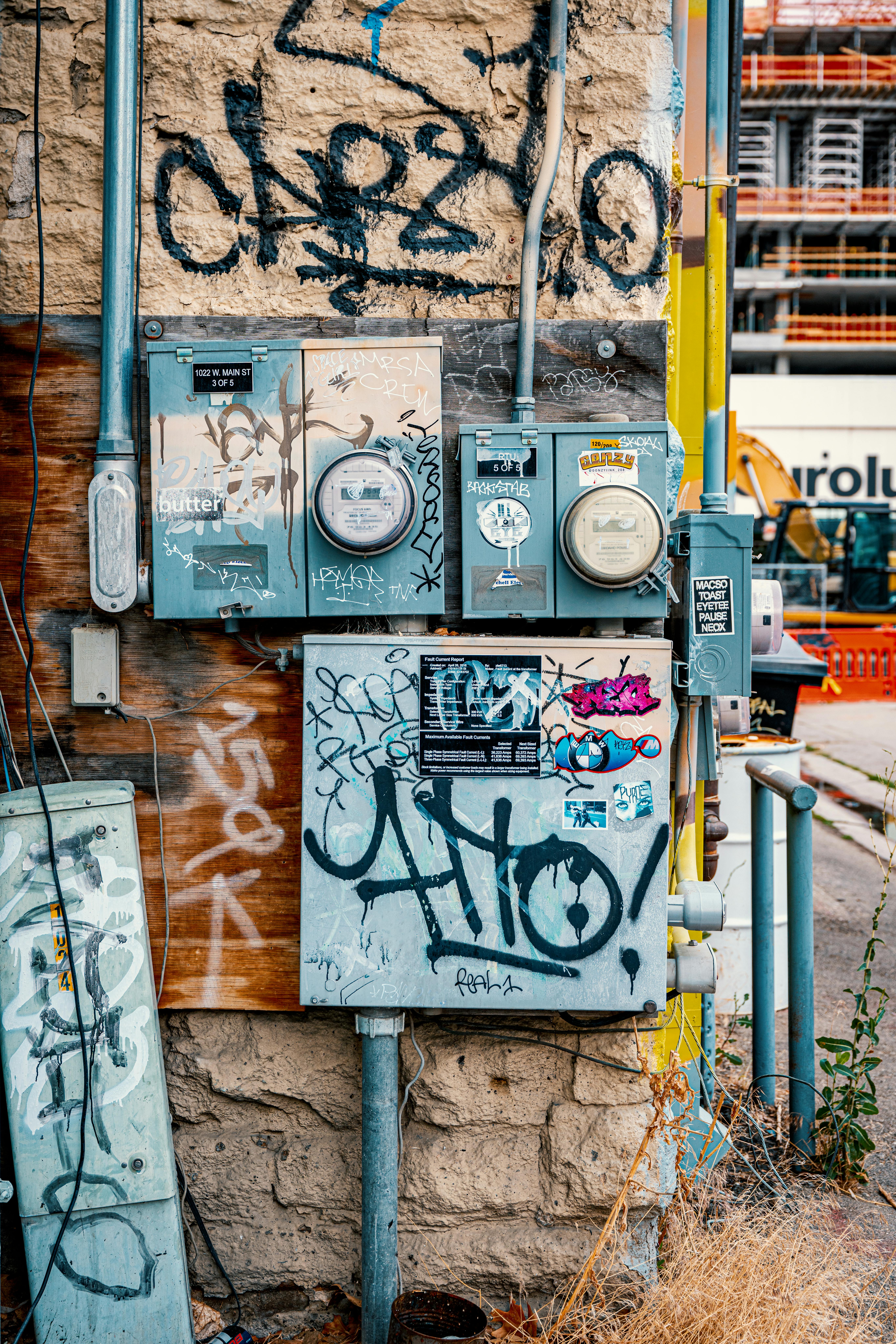 Graffiti on Utility Boxes in Urban Street · Free Stock Photo