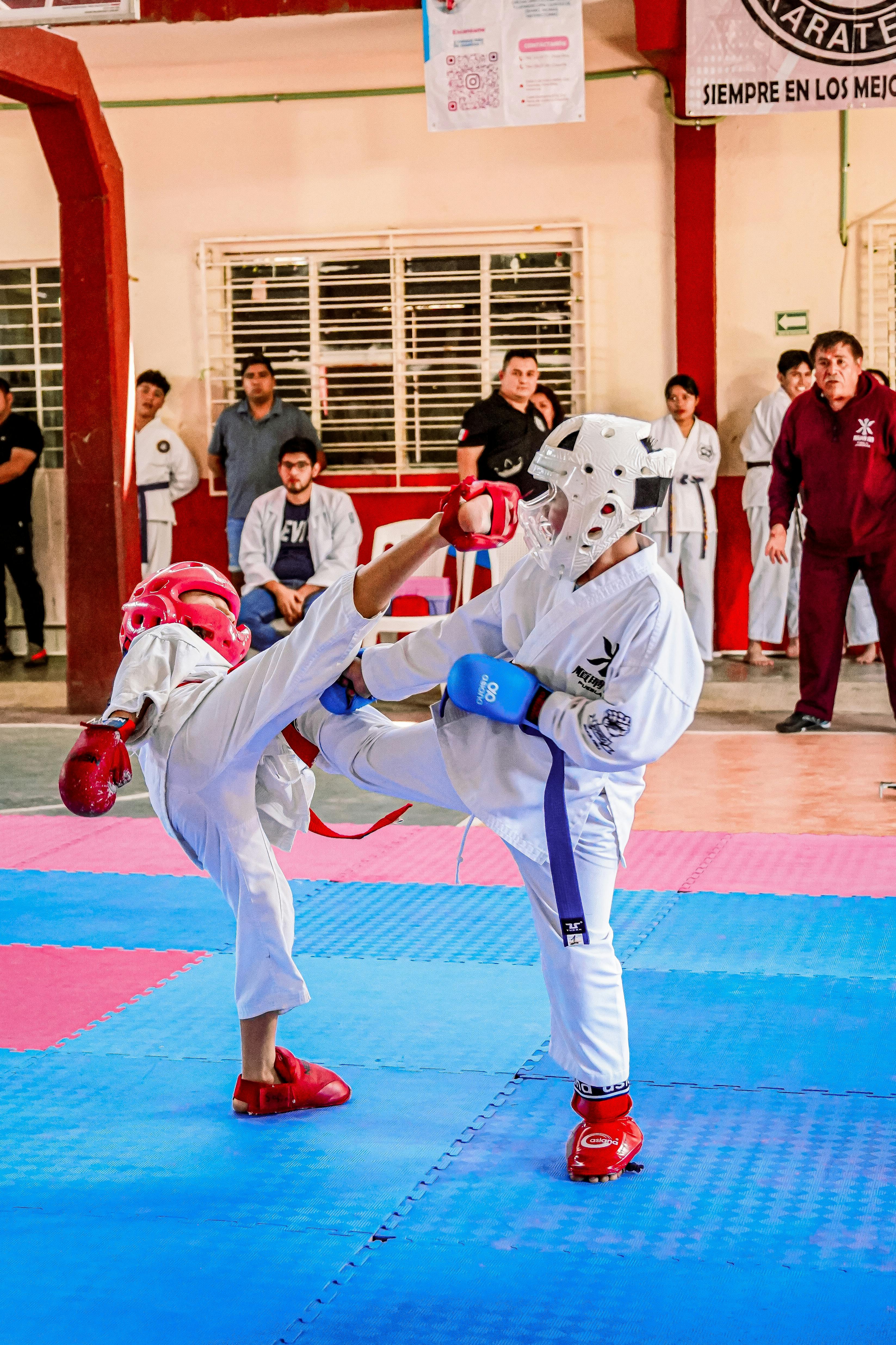 Intense Karate Match in Indoor Arena · Free Stock Photo