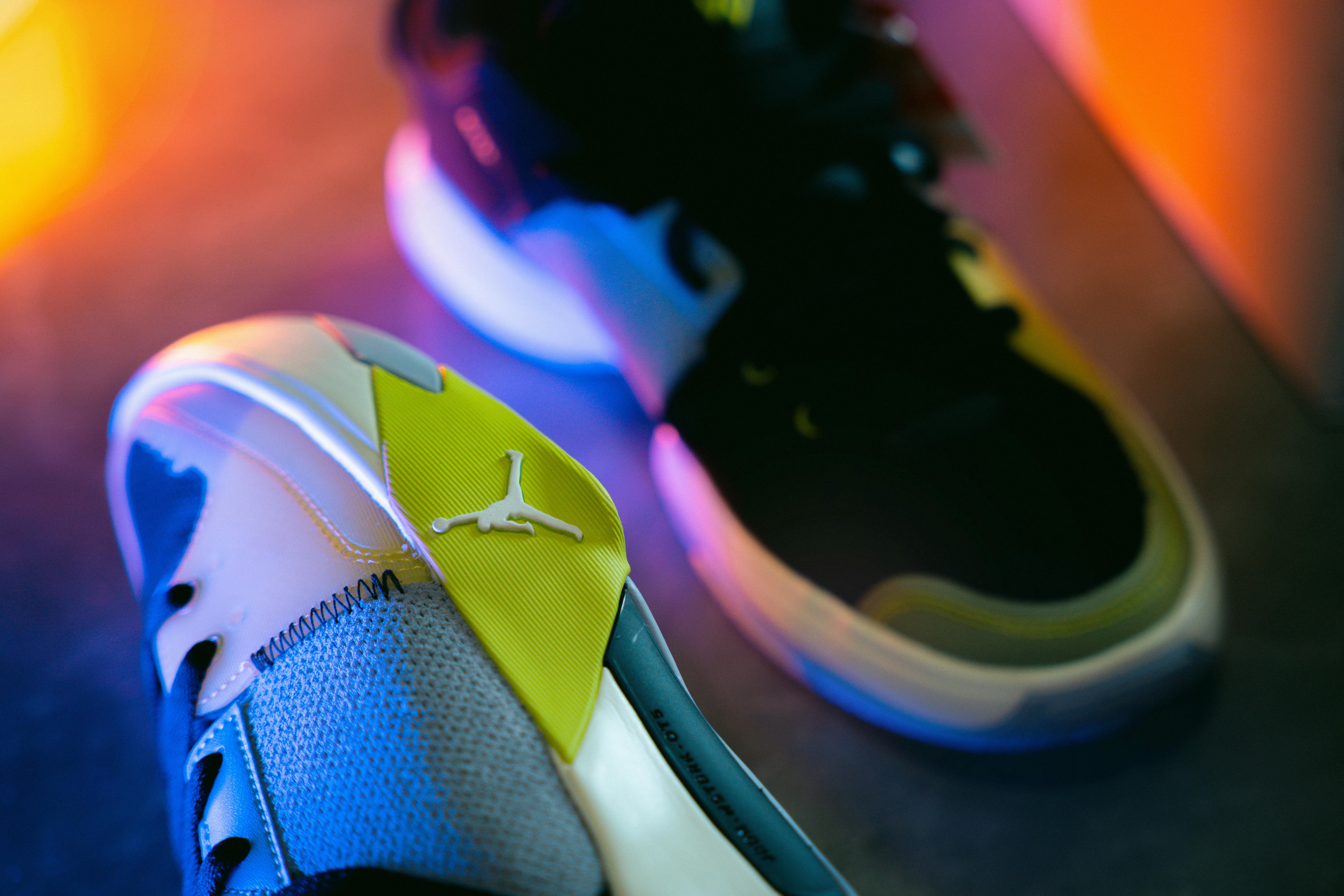 Close-Up of Colorful Athletic Sneakers with Neon Light · Free Stock Photo