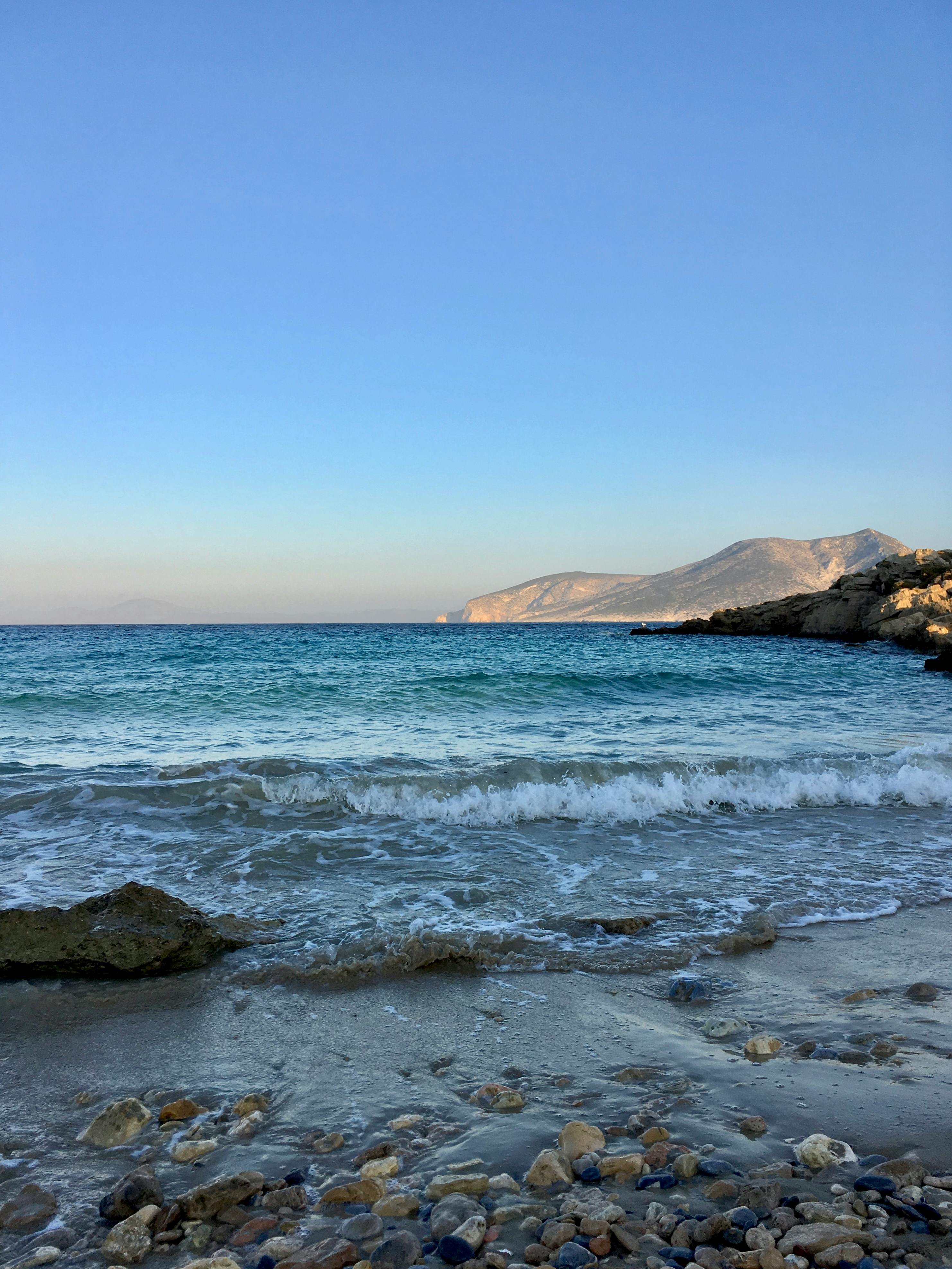 Serene Pebble Beach on Remote Greek Island · Free Stock Photo