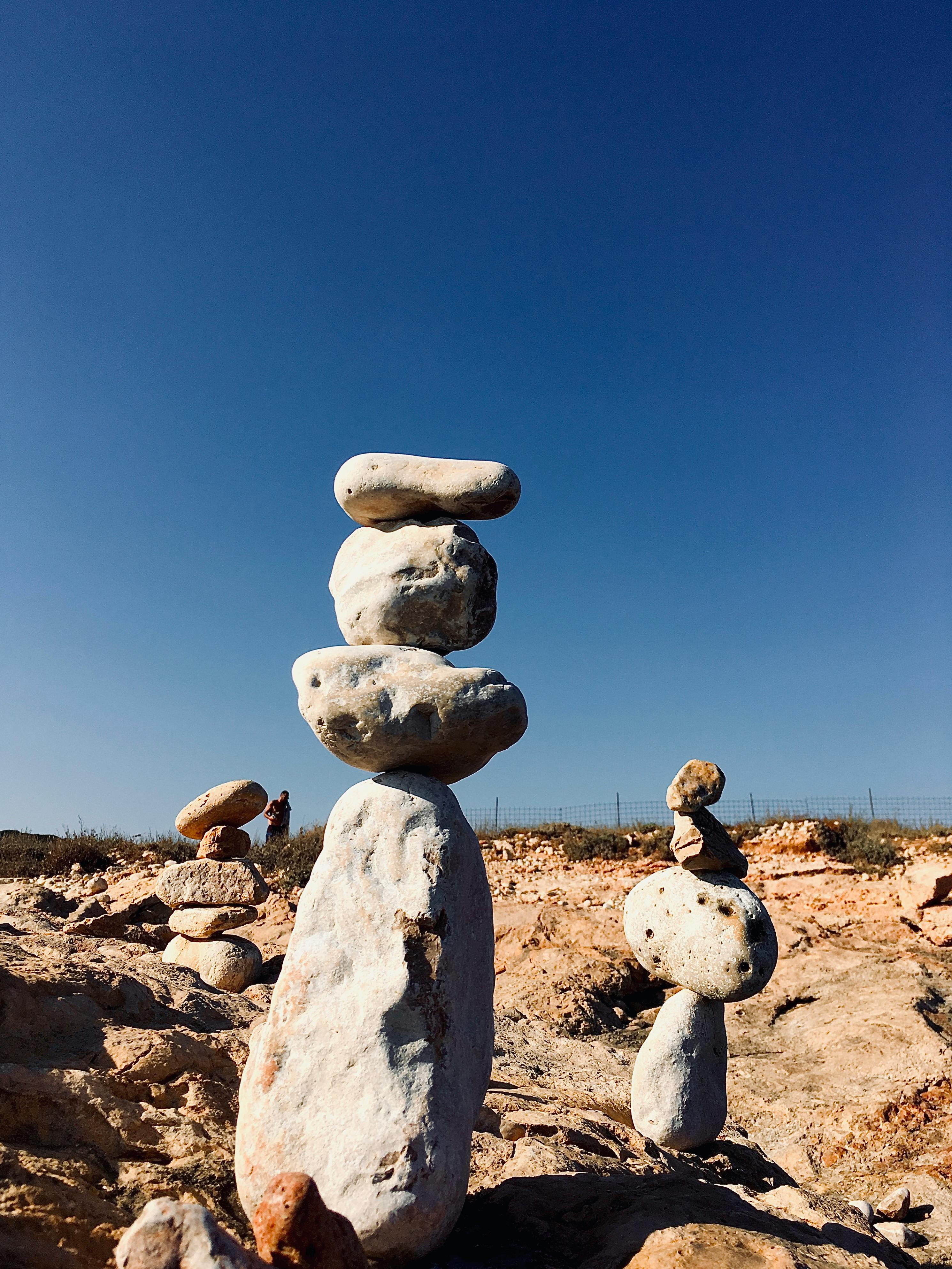 Balanced rock formations under clear blue sky in Greece · Free Stock Photo