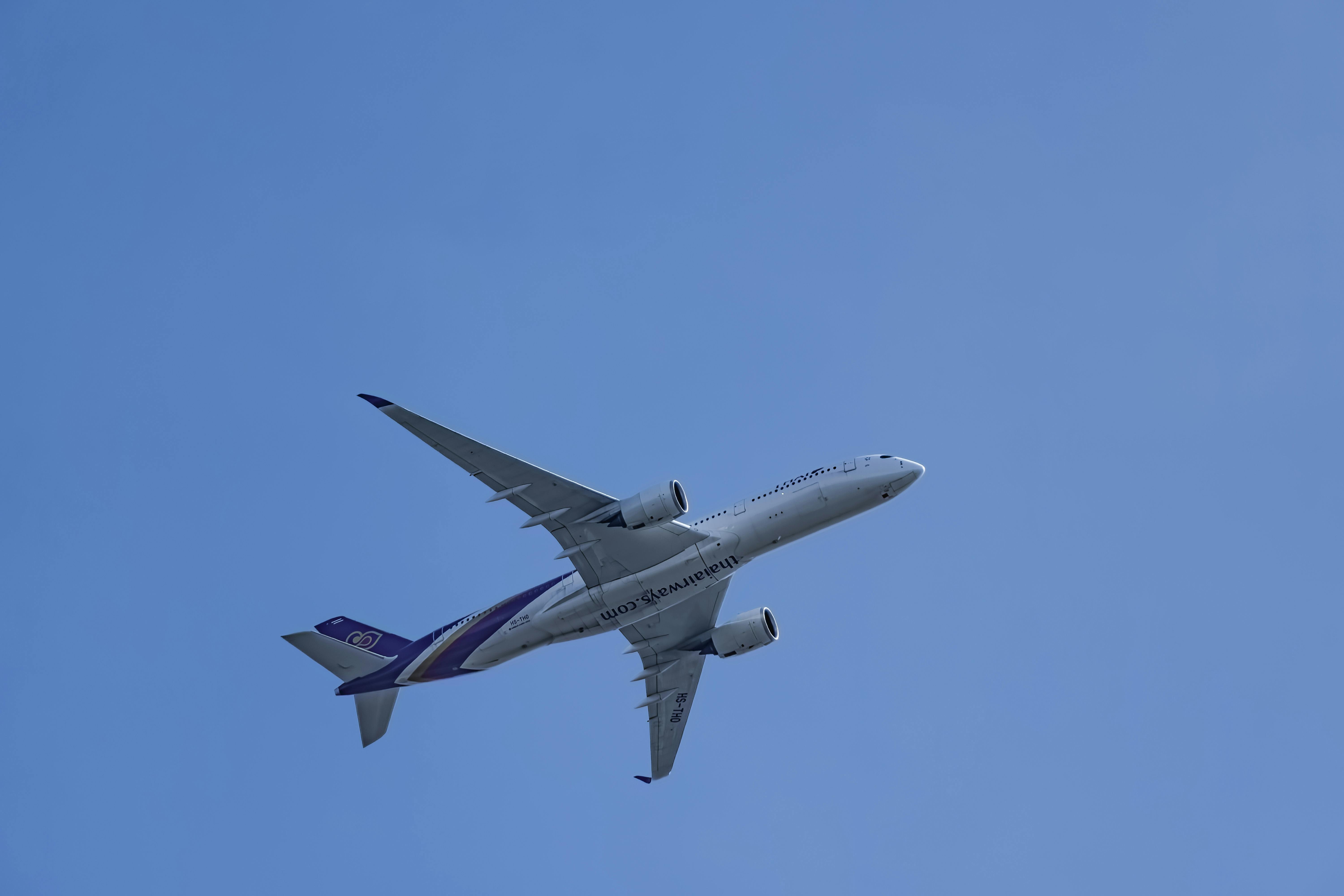 White and Blue Airplane Under White and Blue Sky during Daytime · Free ...