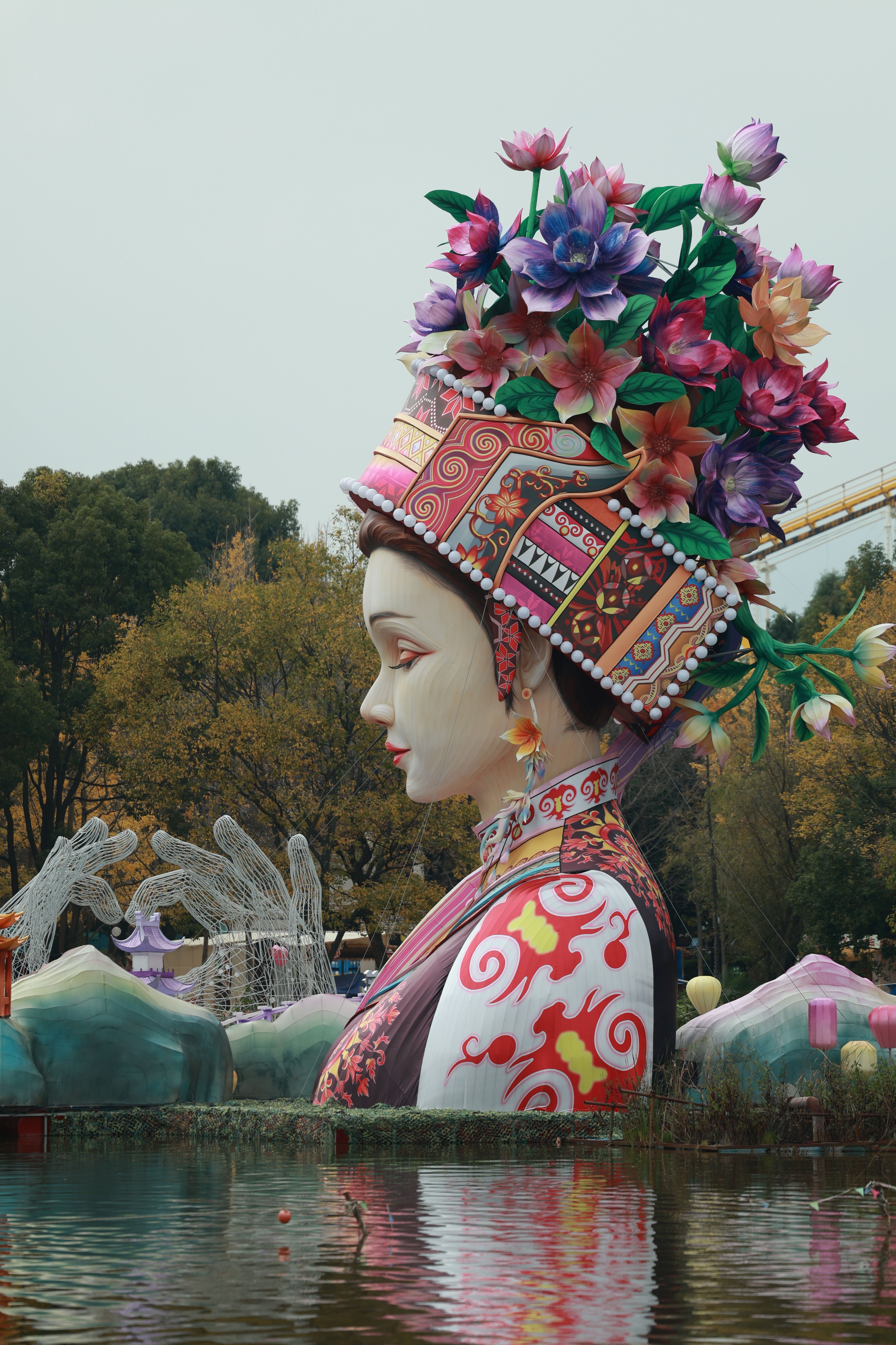 Colorful Statue with Floral Headgear in Park · Free Stock Photo