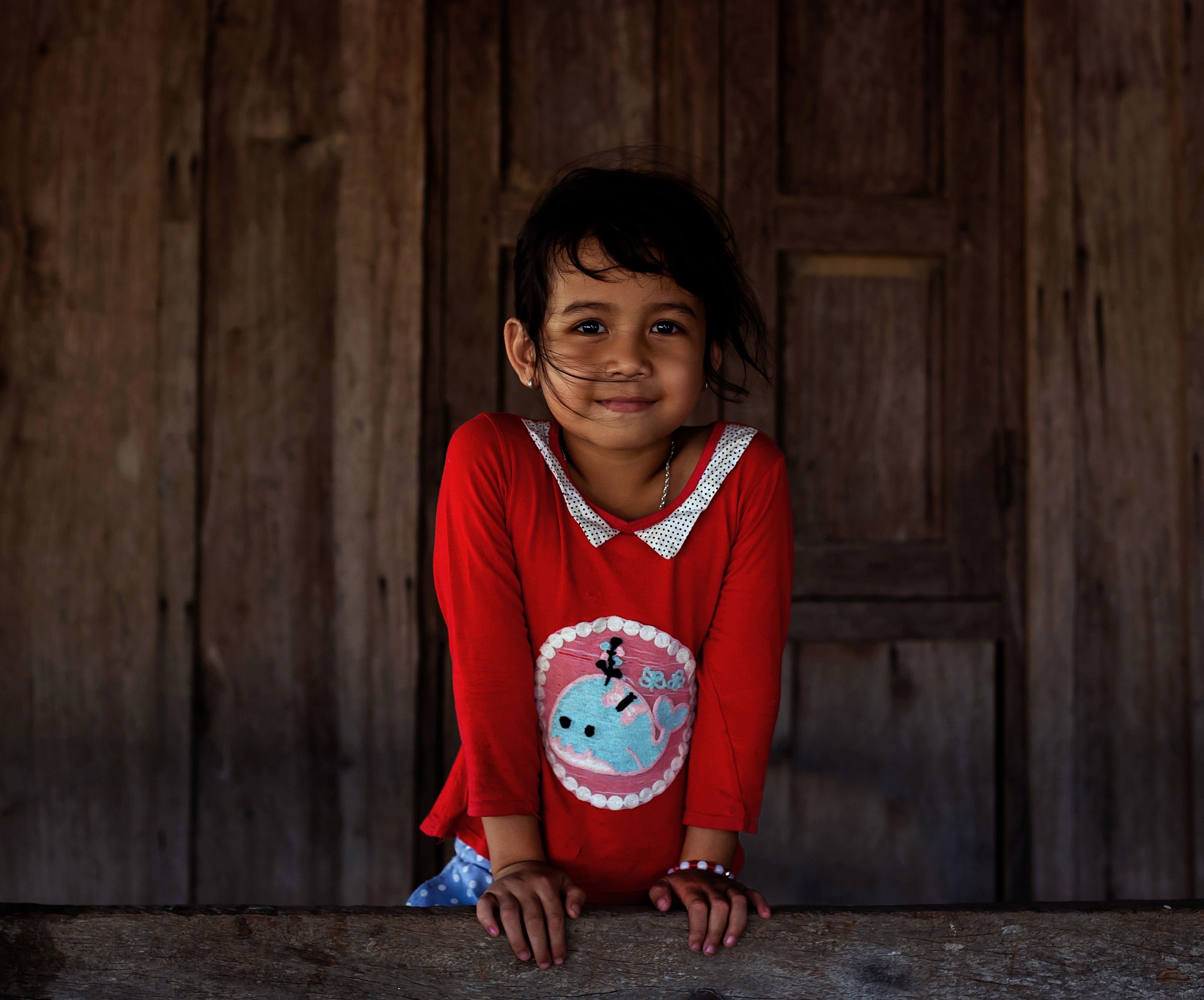 Smiling Vietnamese Girl in Traditional Setting · Free Stock Photo