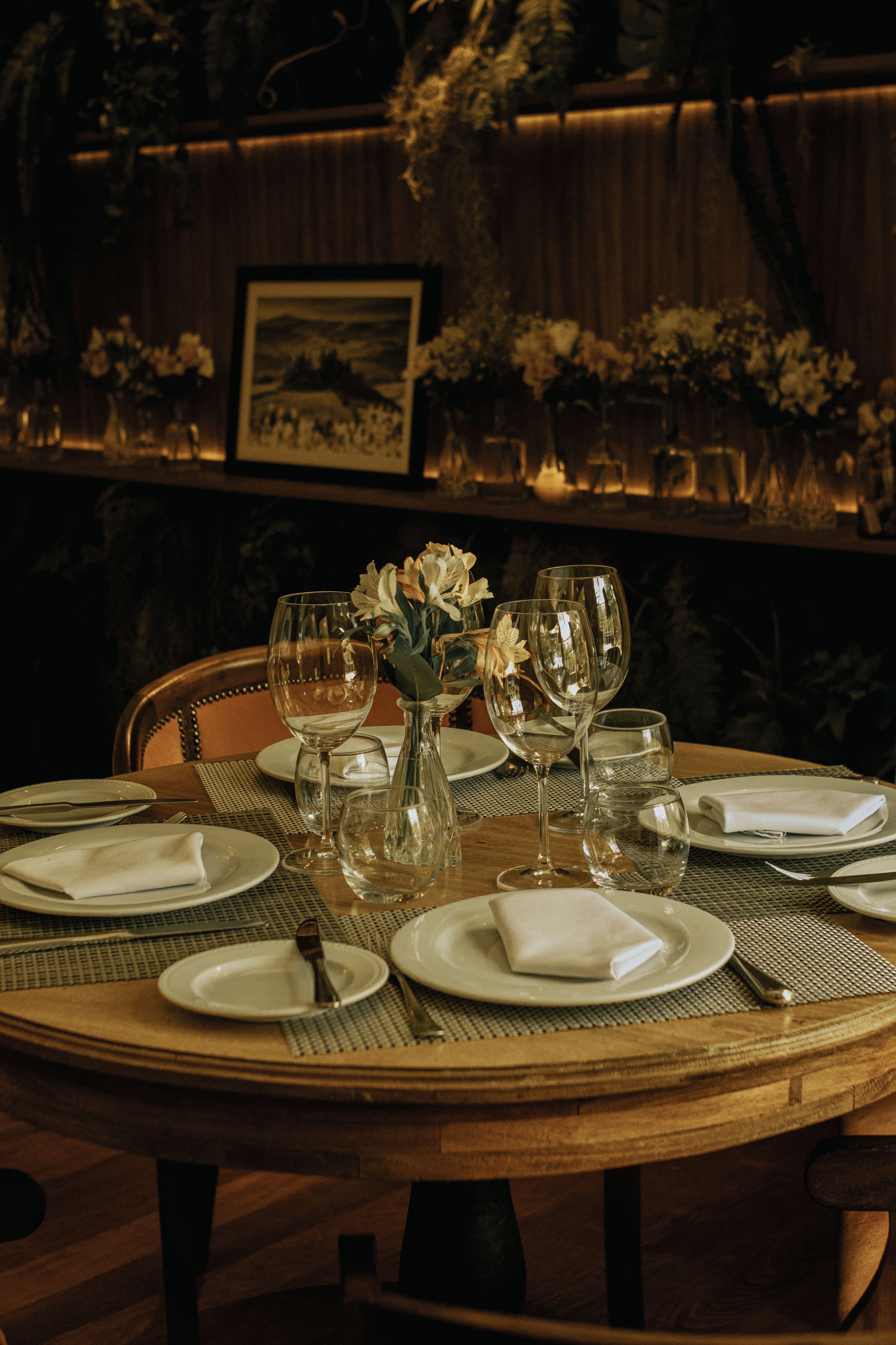 Elegant Table Setting in a Dimly Lit Restaurant · Free Stock Photo