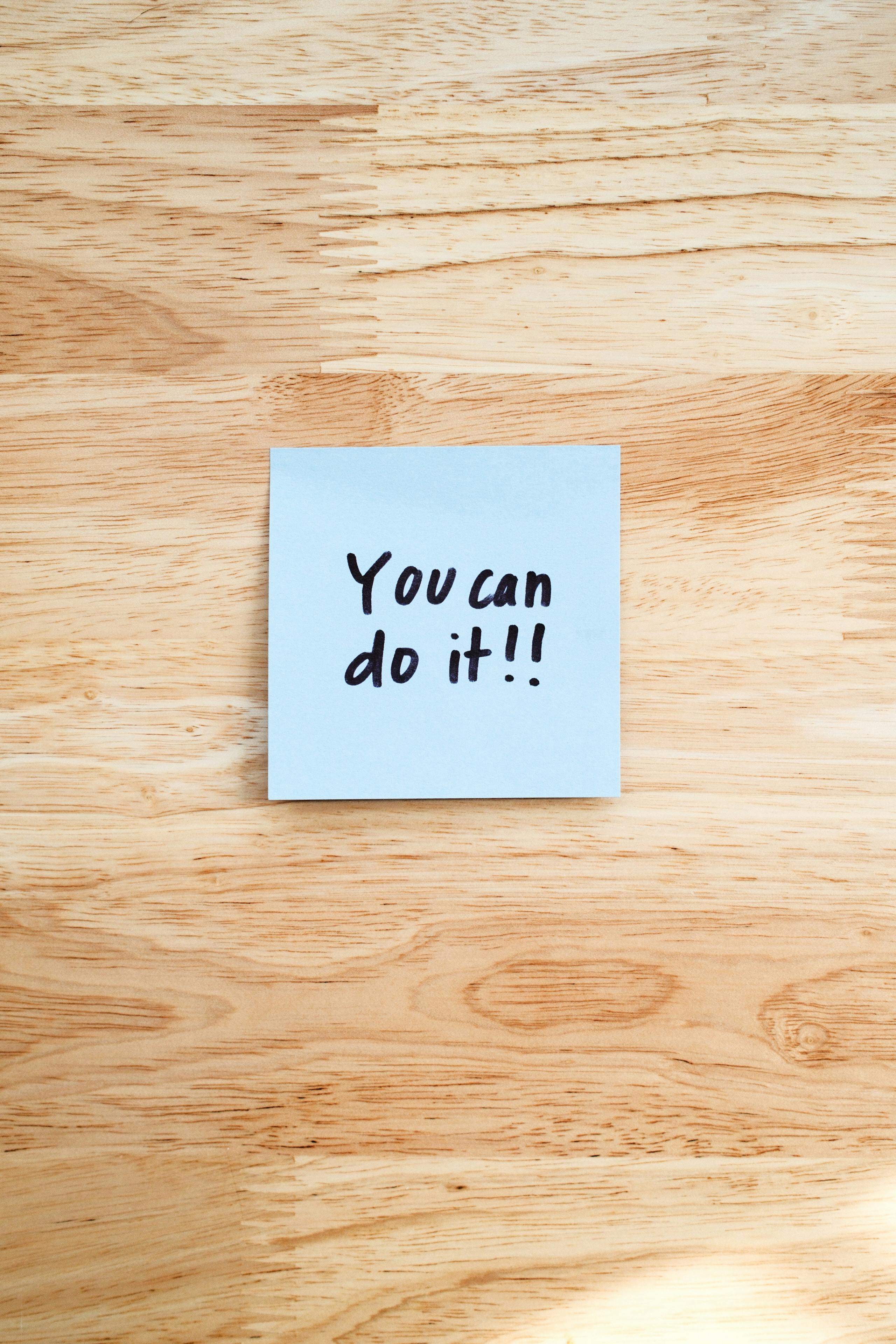 Inspirational Post-It Note on Wooden Surface · Free Stock Photo