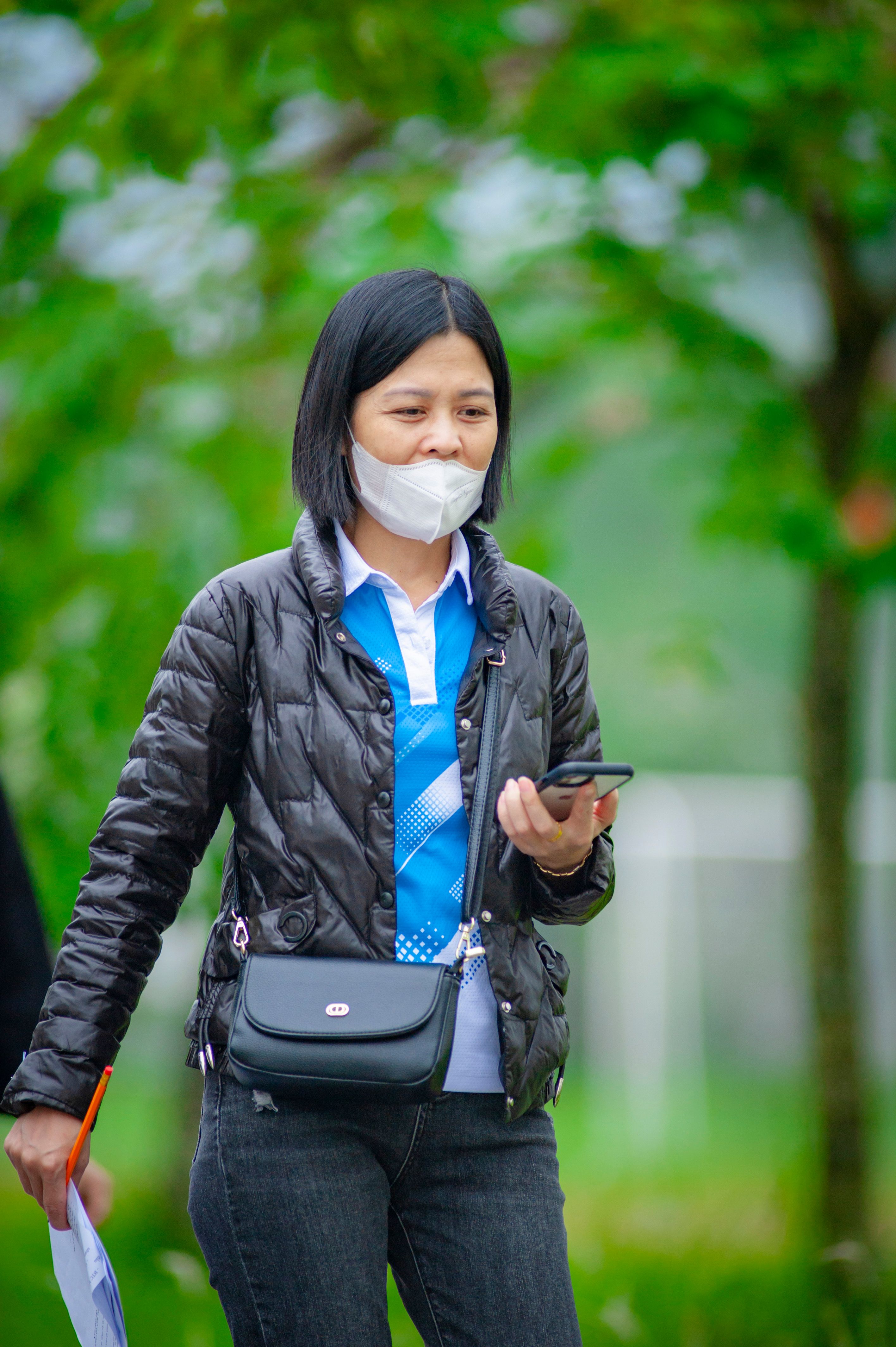 Woman in Hà Nội Wearing Face Mask Outdoors · Free Stock Photo
