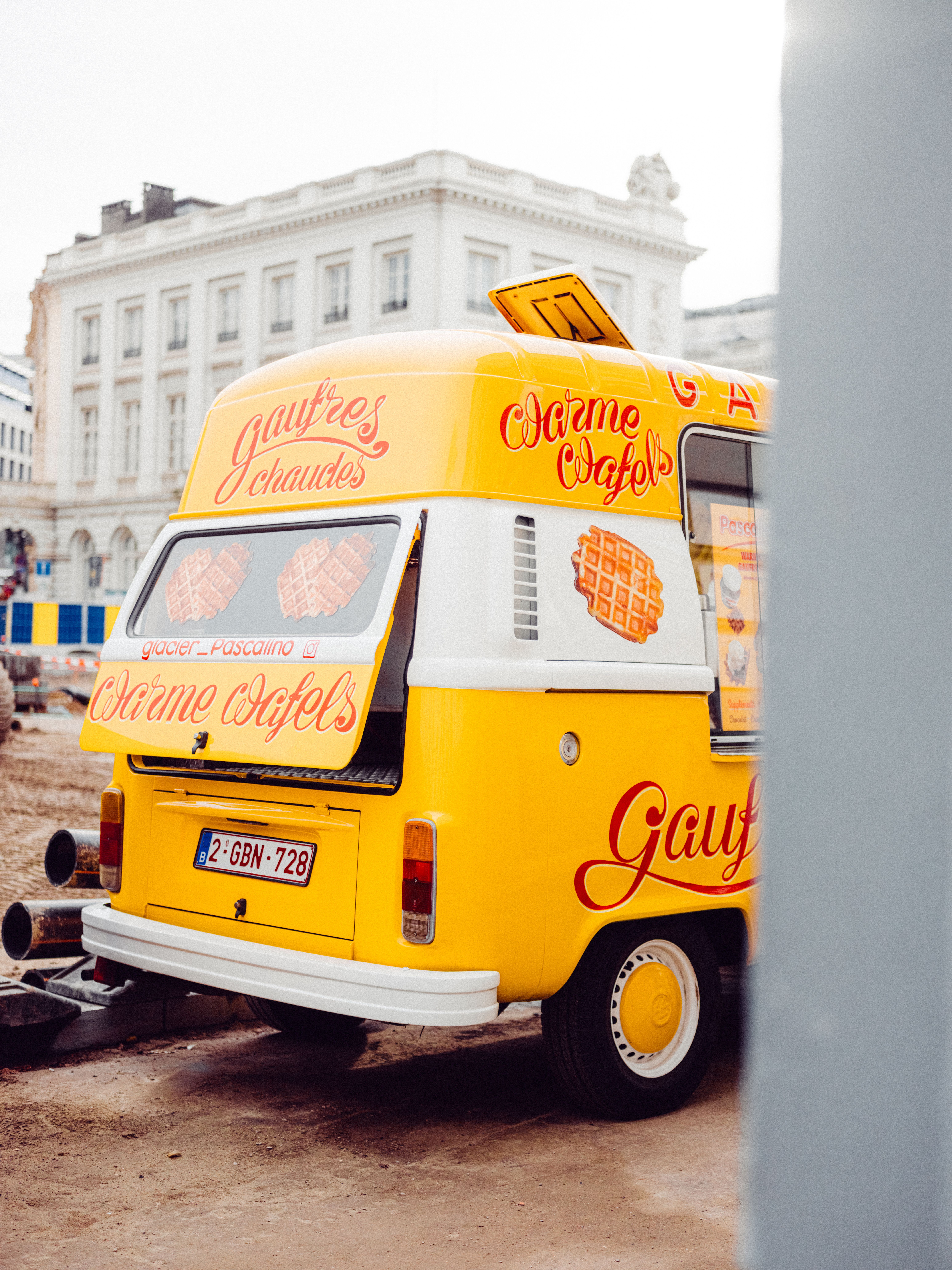 Bright Yellow Belgian Waffle Van in City Setting · Free Stock Photo