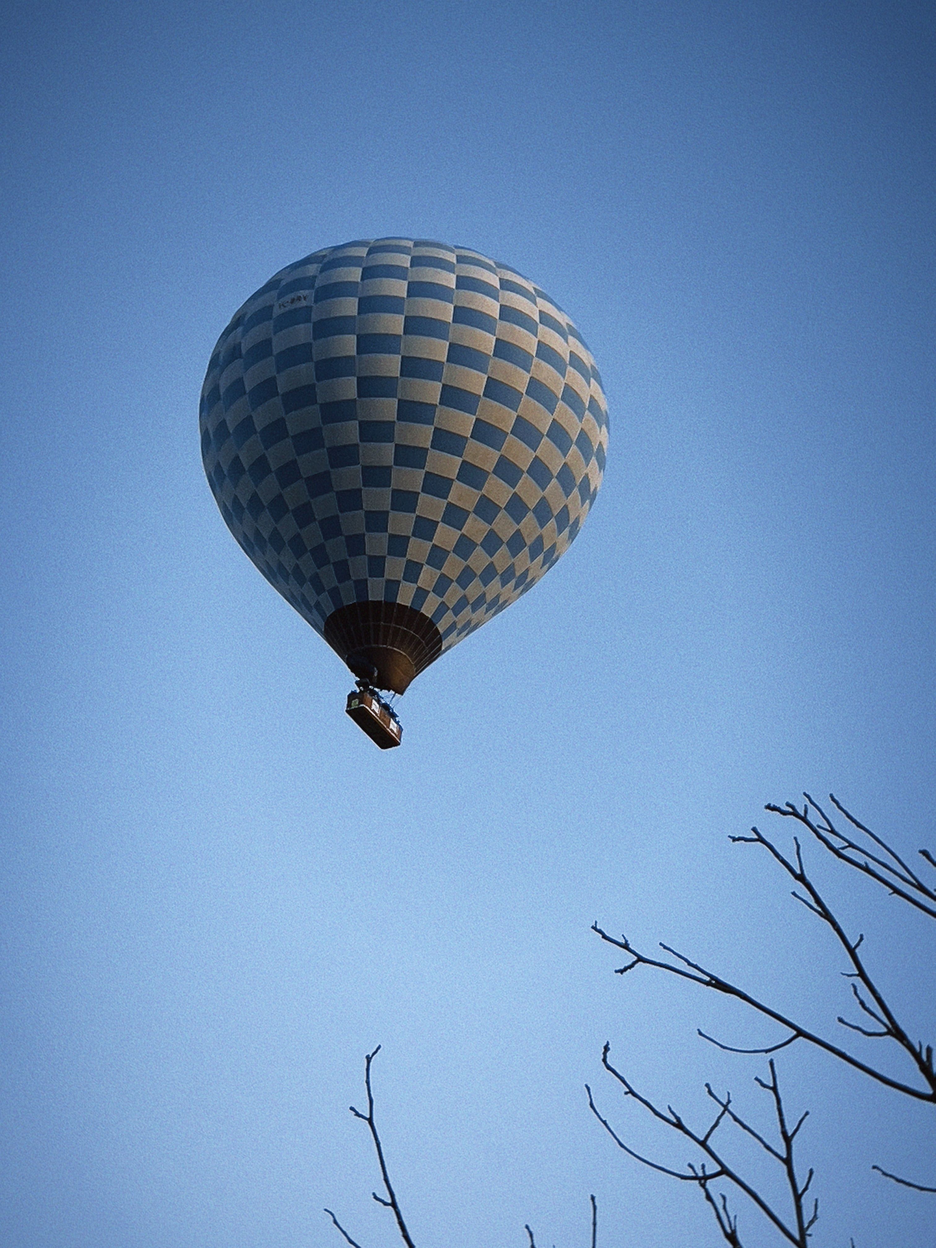 Hot Air Balloon Soaring in Clear Blue Sky · Free Stock Photo
