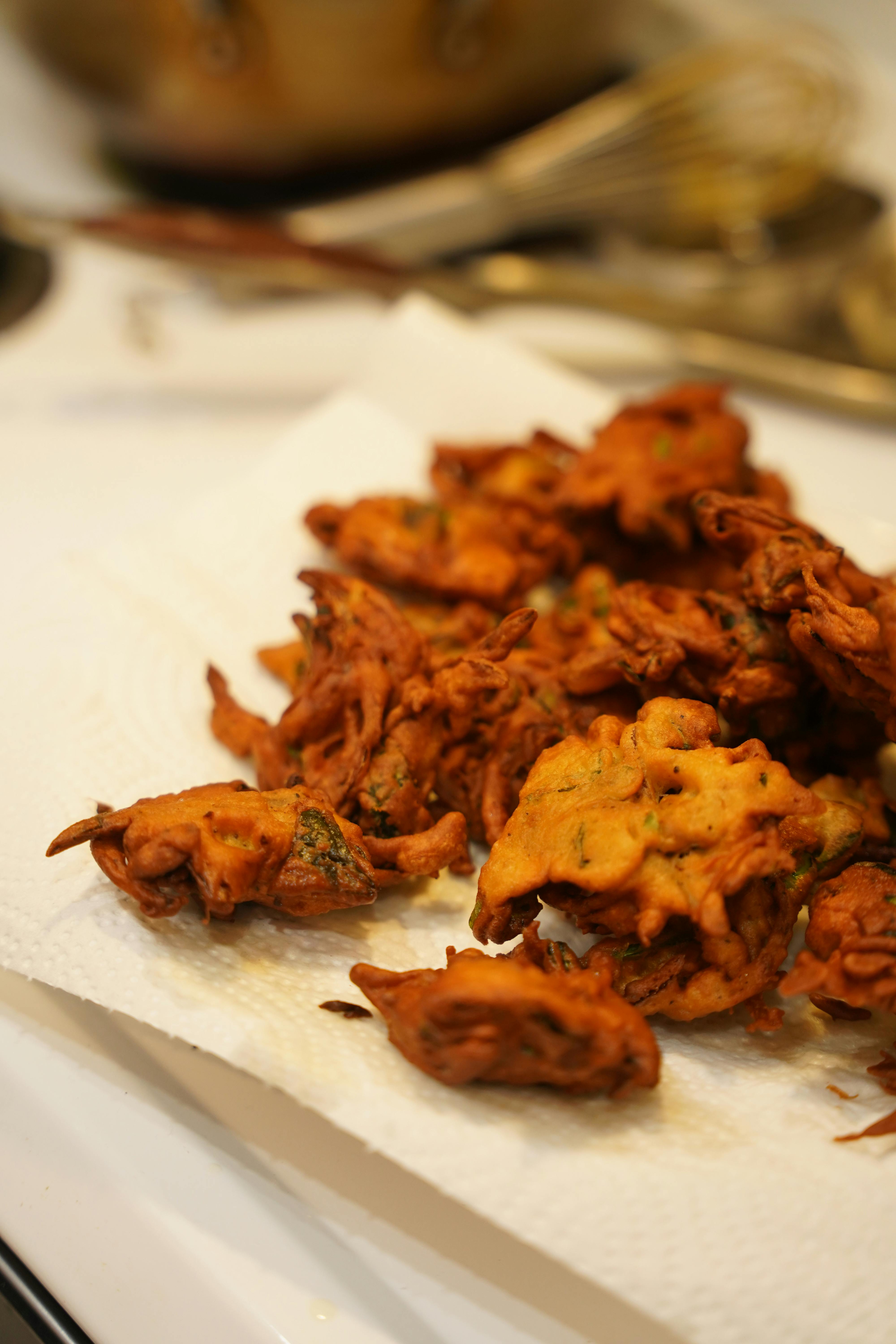 Crispy Homemade Indian Pakora on Paper Towel · Free Stock Photo