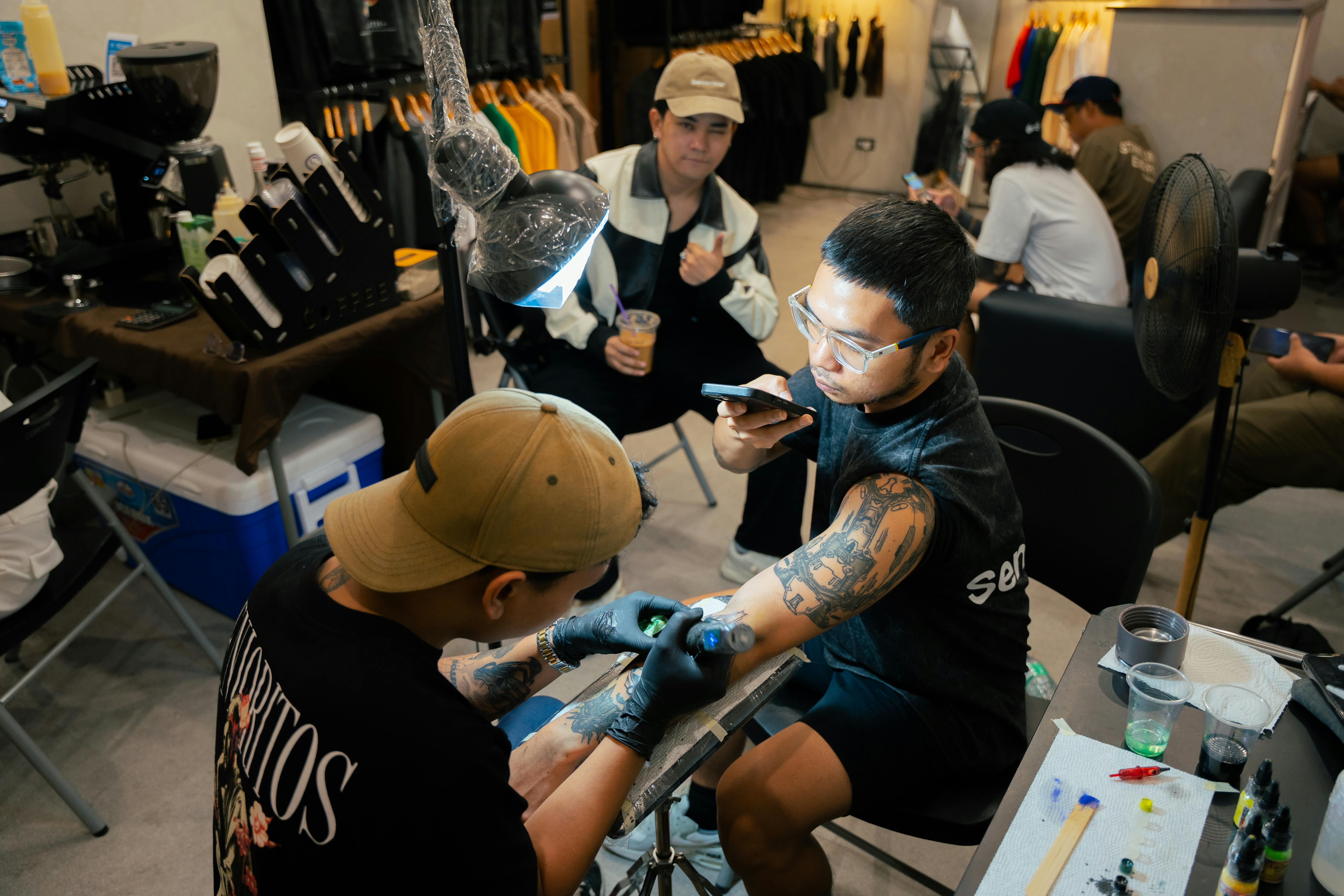 Tattoo Artist Inking Design in Studio · Free Stock Photo