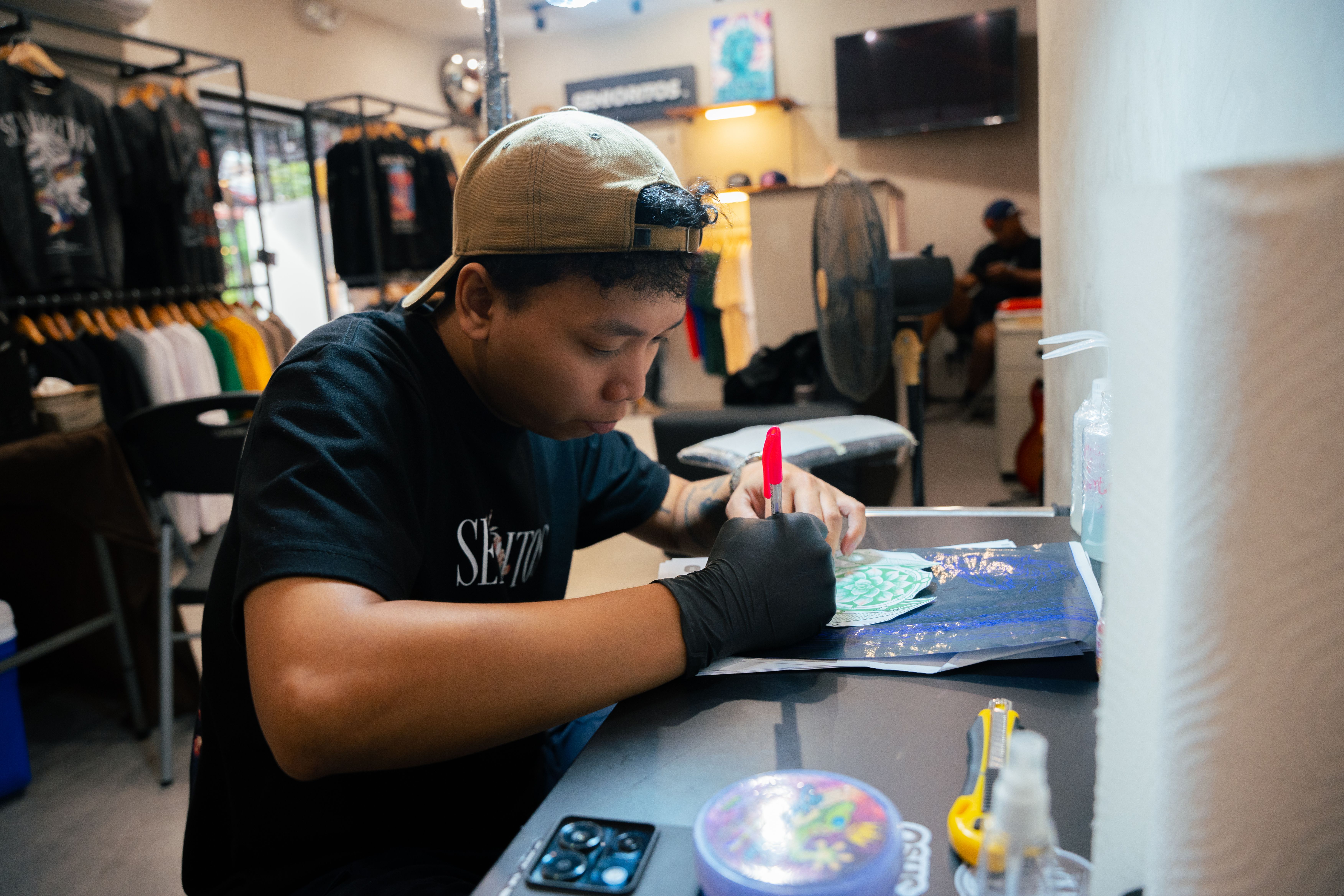 Young Artist Working in T-Shirt Design Studio · Free Stock Photo