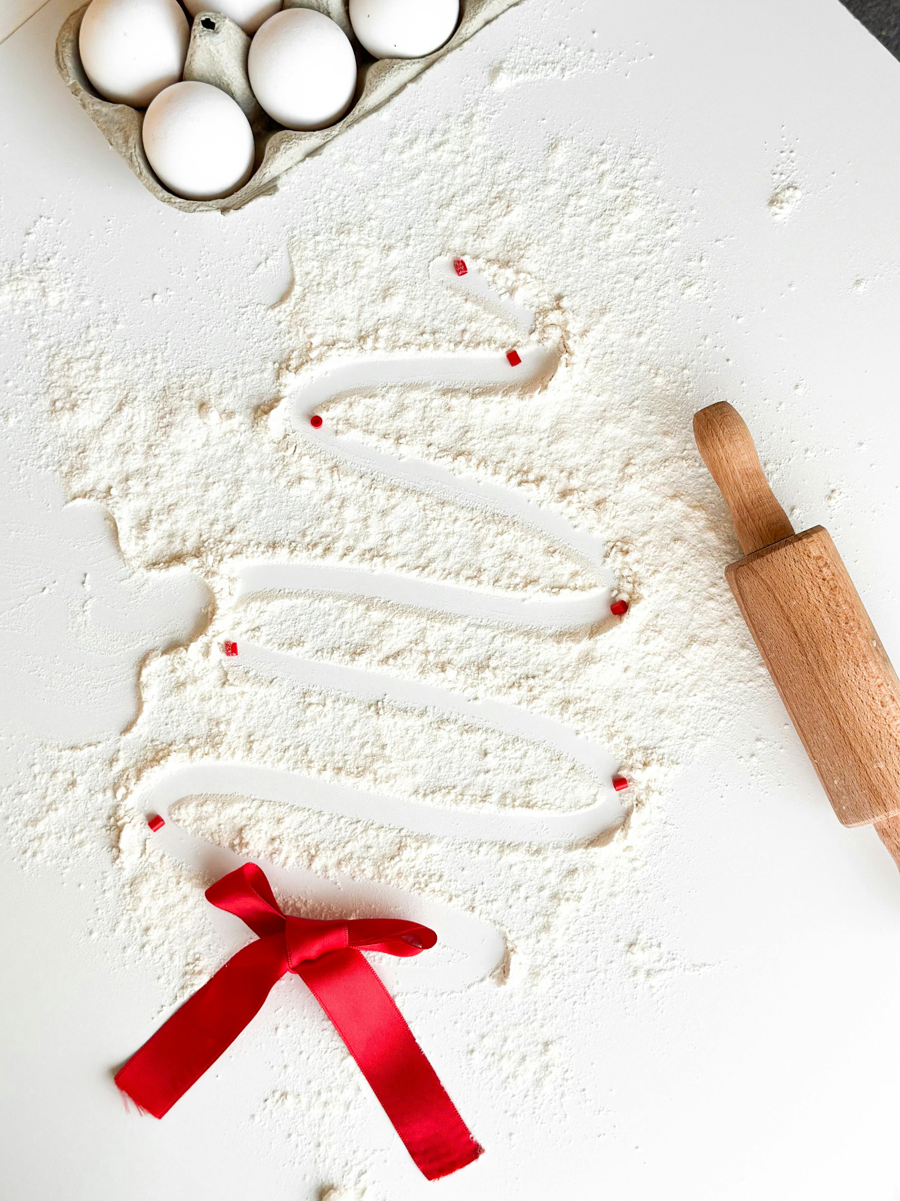 Festive Baking Setup: Flour Christmas Tree Design · Free Stock Photo