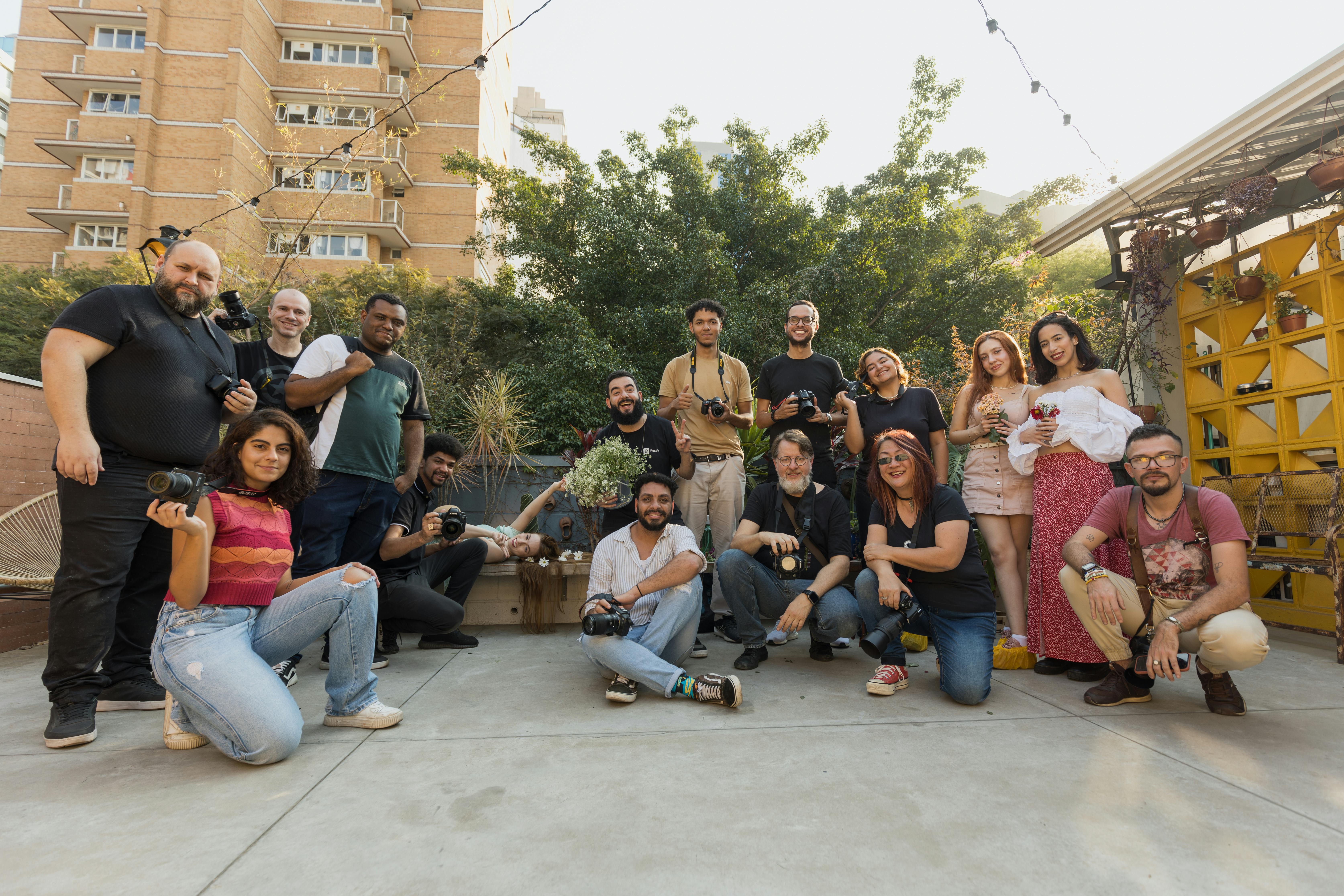 Group of Photographers Gathering Outdoors · Free Stock Photo