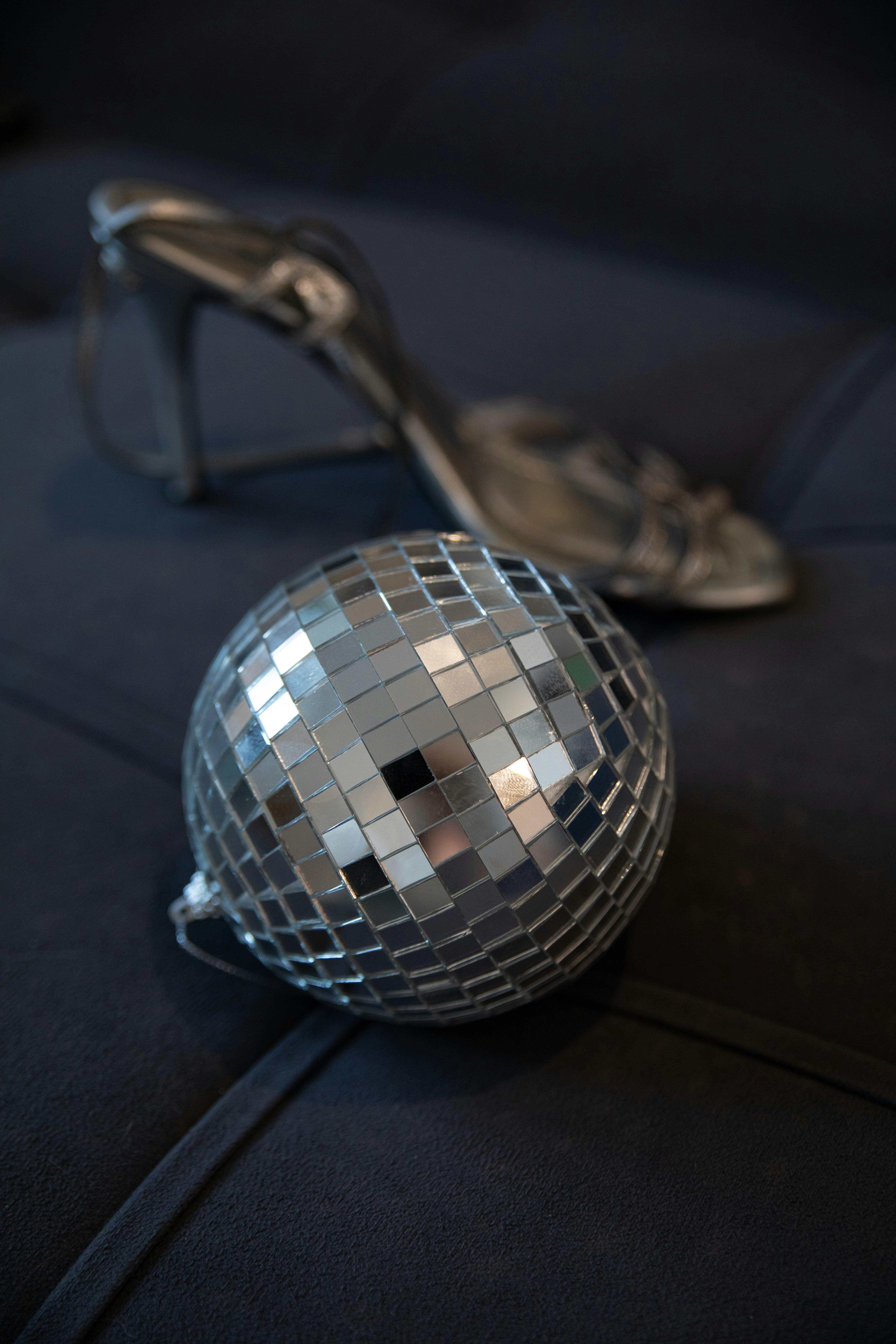 Elegant Black Stiletto and Disco Ball Scene · Free Stock Photo