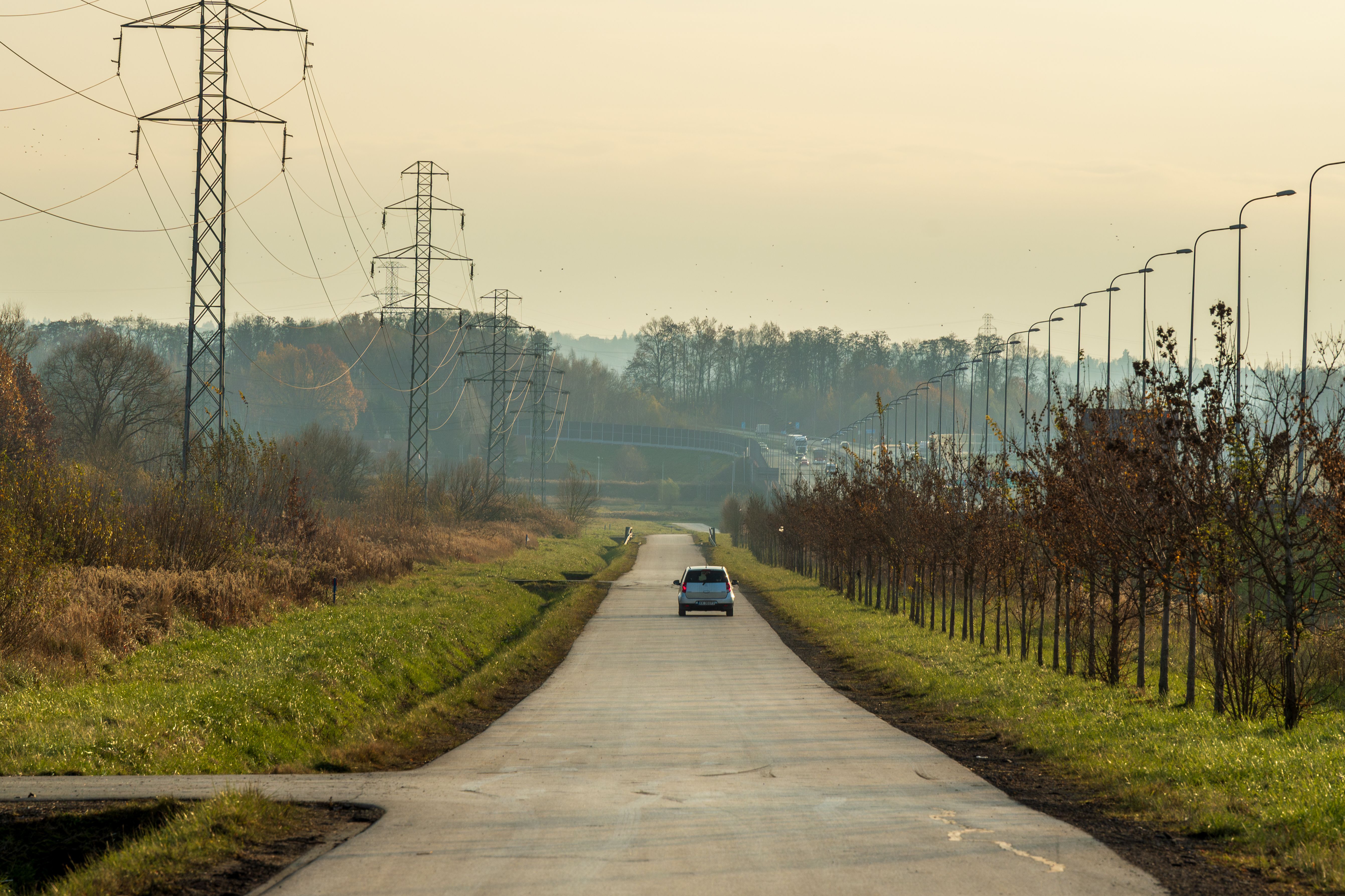 Scenic Countryside Road with Power Lines · Free Stock Photo