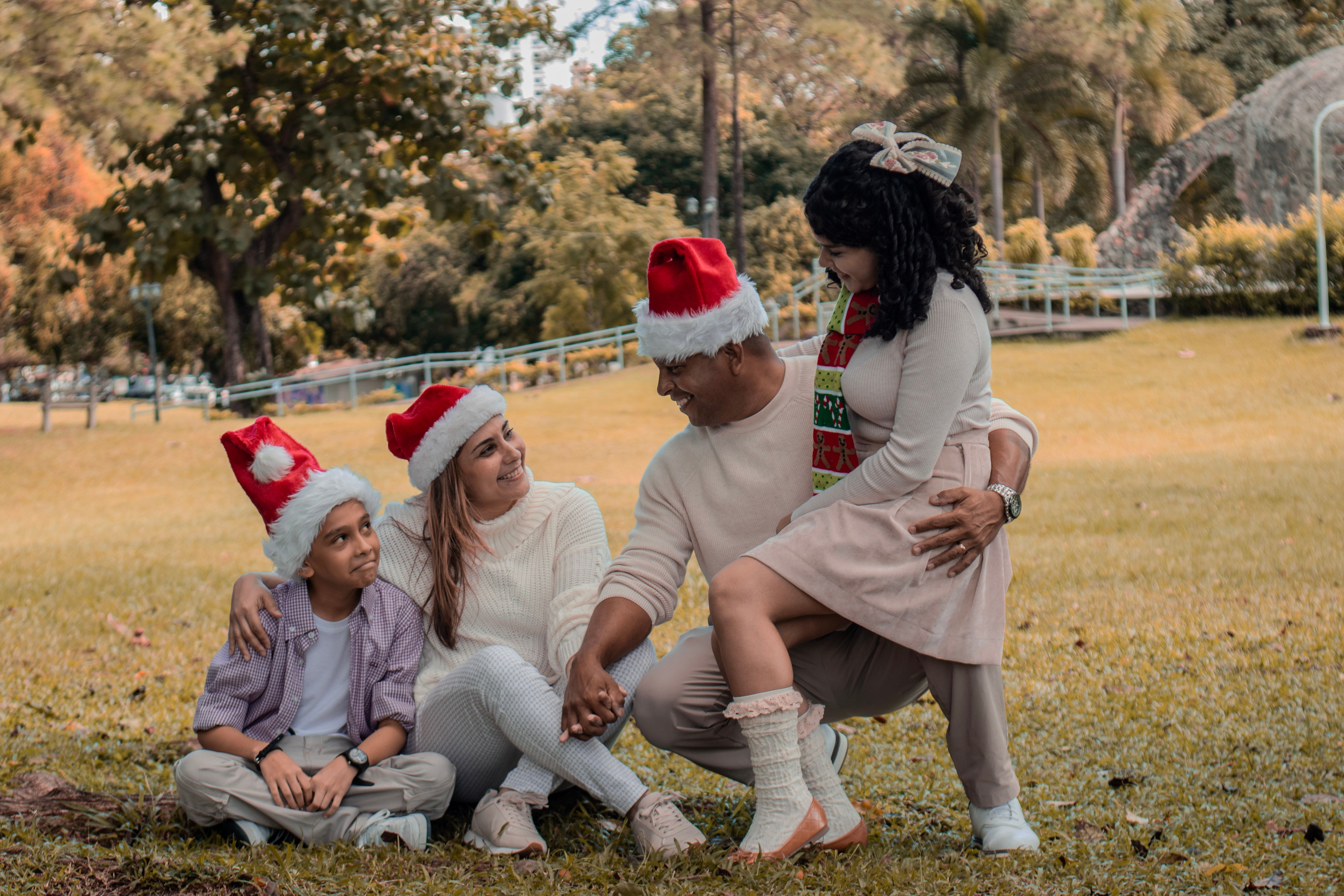 Family Celebrating Christmas Outdoors in Park · Free Stock Photo