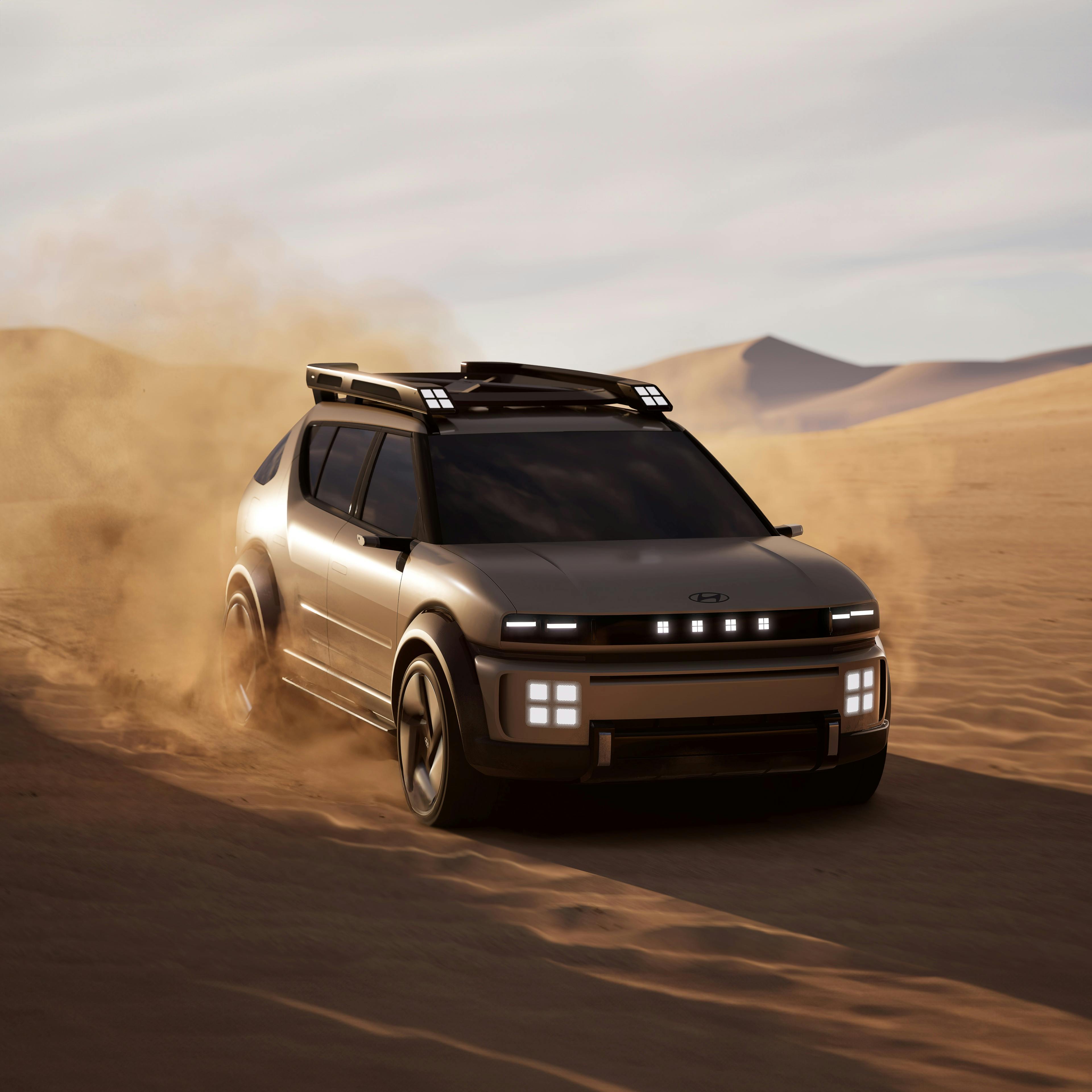 Futuristic SUV Navigating Desert Terrain · Free Stock Photo