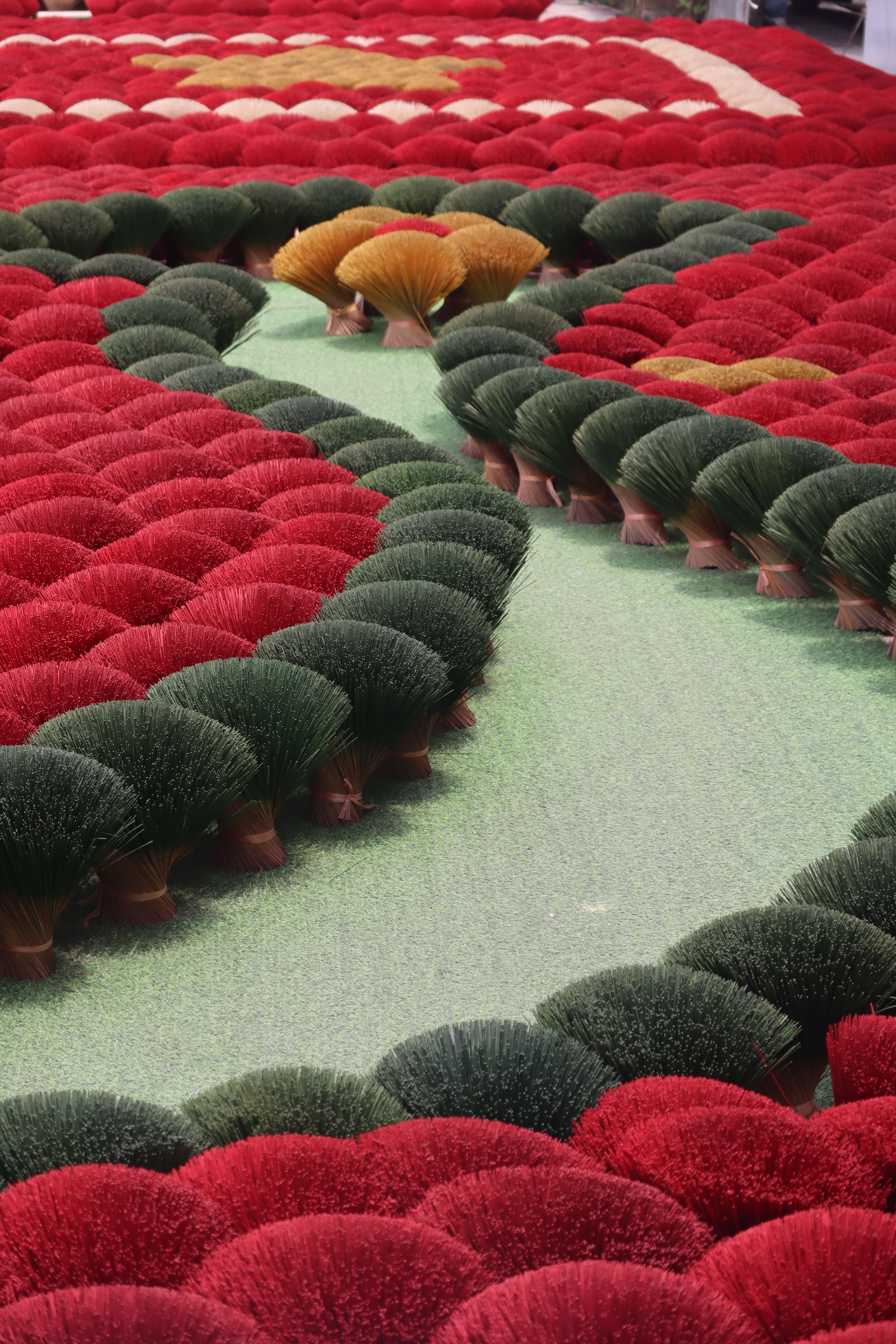 Artistic Arrangement of Colorful Brooms in Hanoi · Free Stock Photo