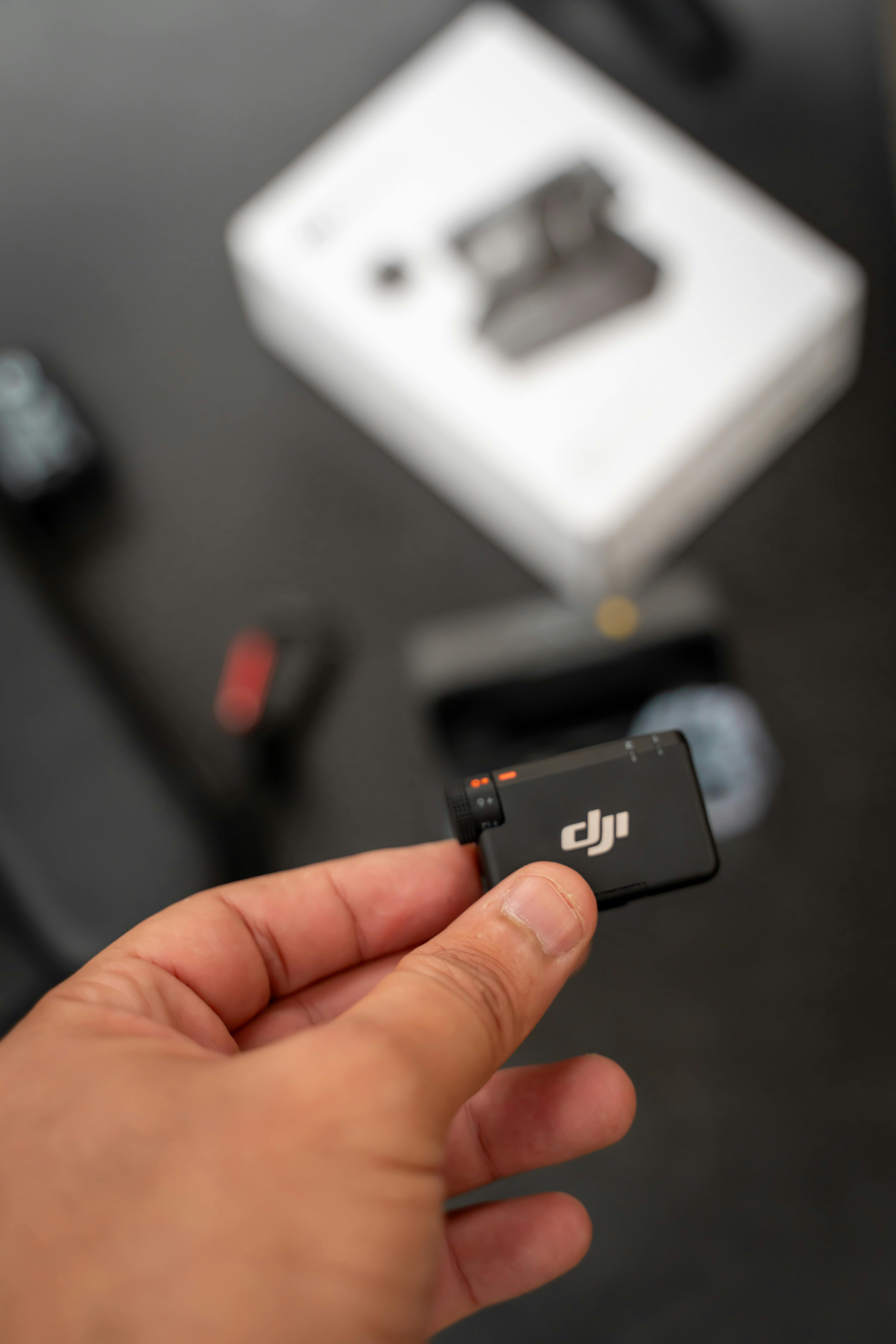 Close-up of Hand Holding DJI Camera Microphone · Free Stock Photo