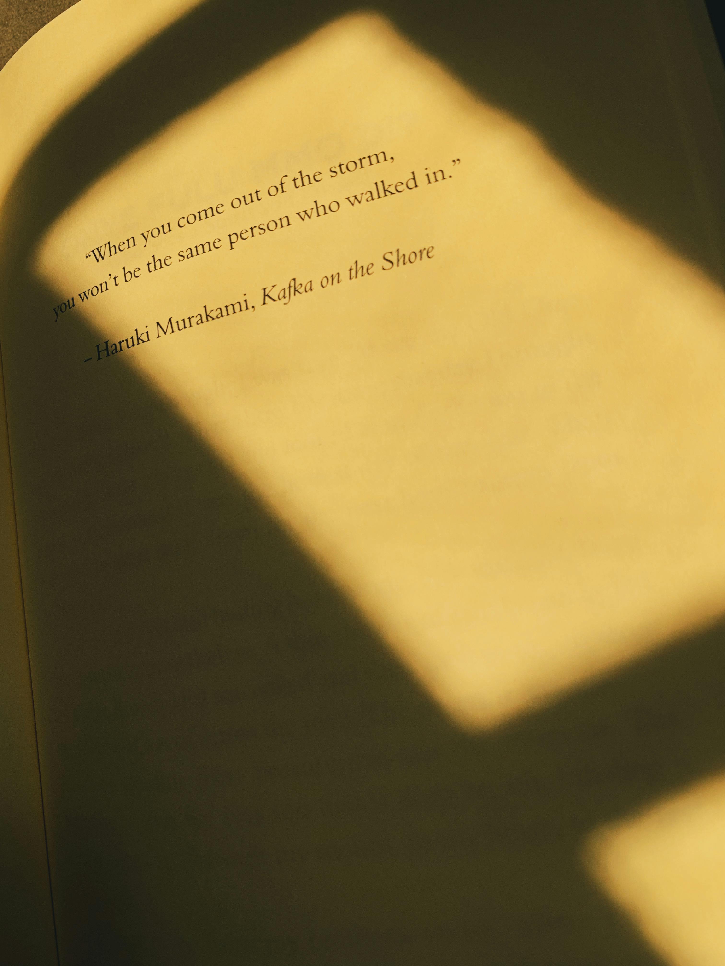 Shadowed Book Page with Inspirational Quote · Free Stock Photo