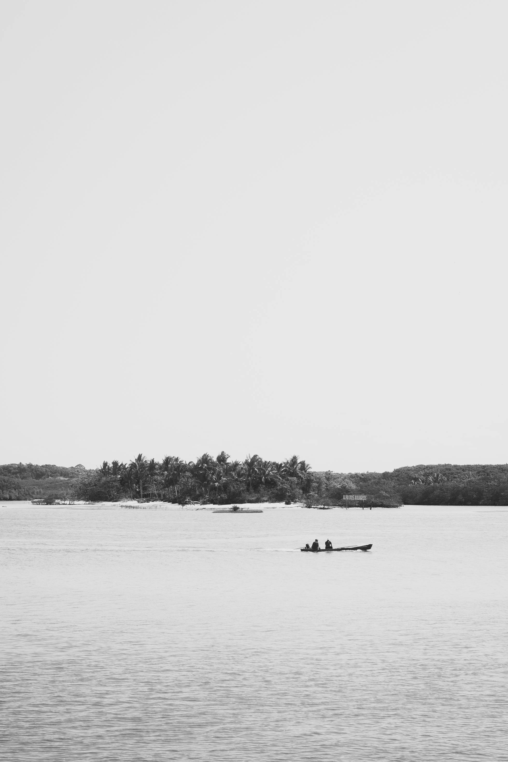 Serene Black and White Ocean Scene with Boat · Free Stock Photo