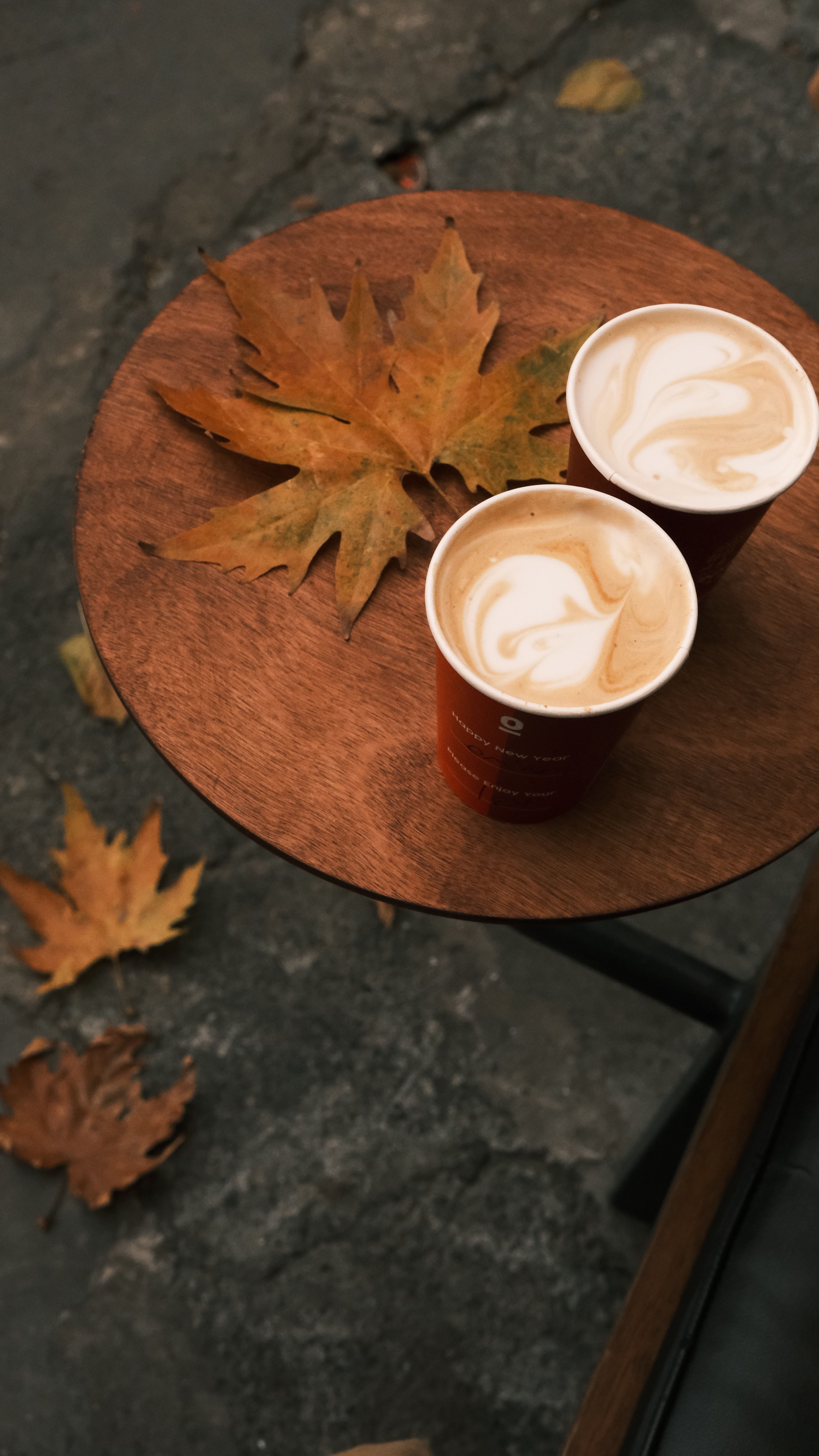 Cozy Autumn Latte Art on Wooden Table · Free Stock Photo
