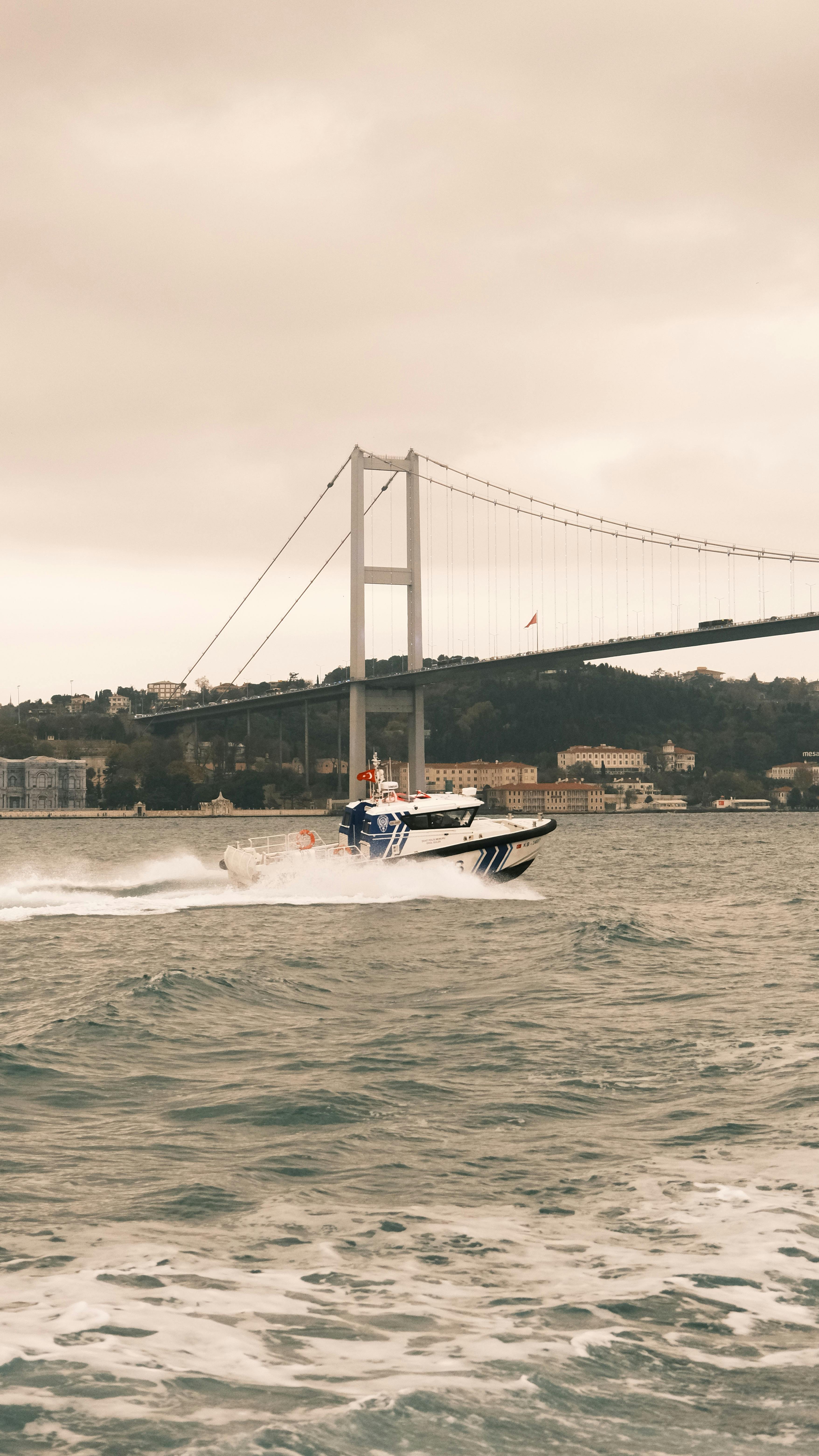 Speedboat on Bosphorus with Bridge View · Free Stock Photo