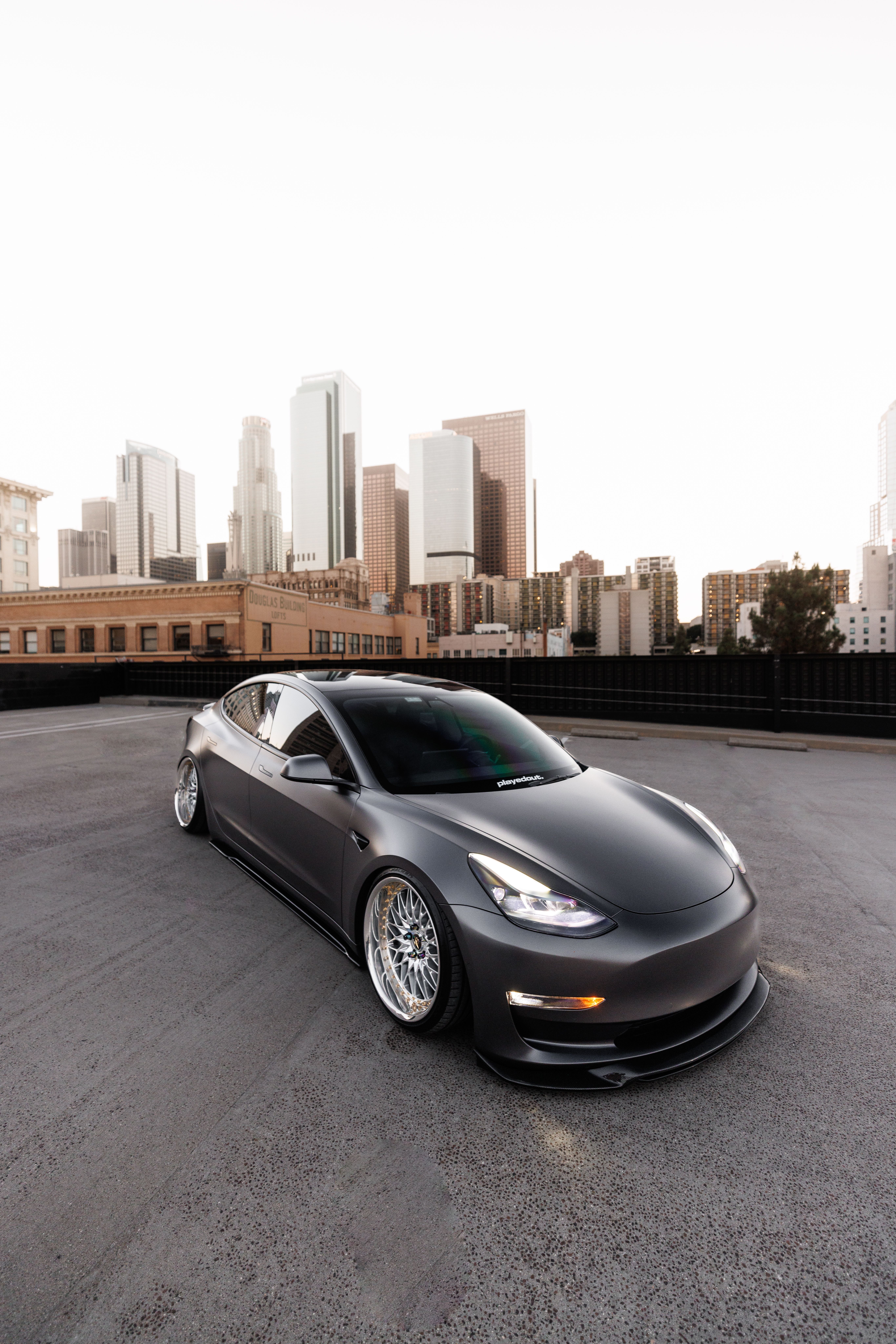 Sleek Car on Los Angeles Rooftop at Sunset · Free Stock Photo