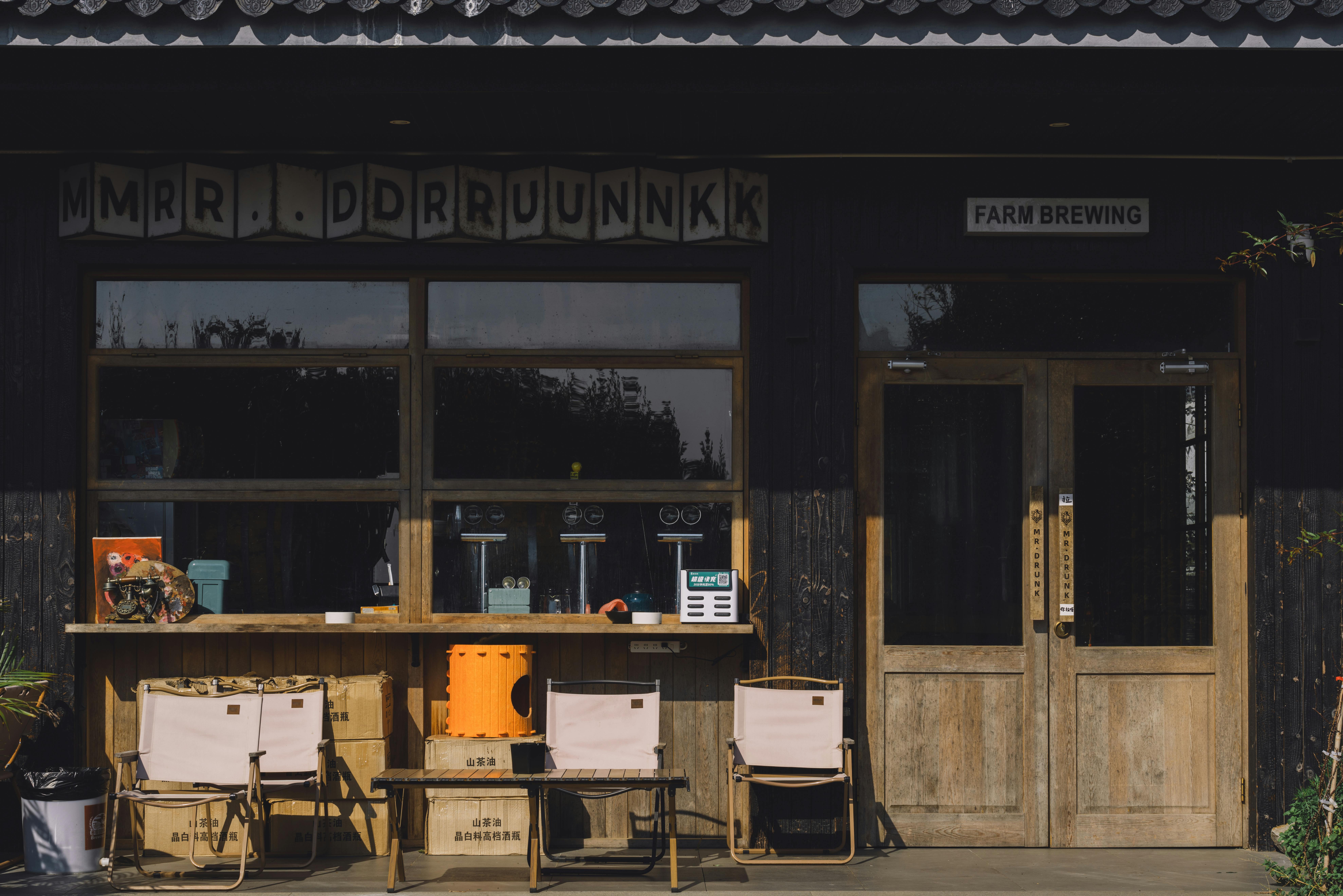 Rustic Farm Brewing Entrance with Seating · Free Stock Photo