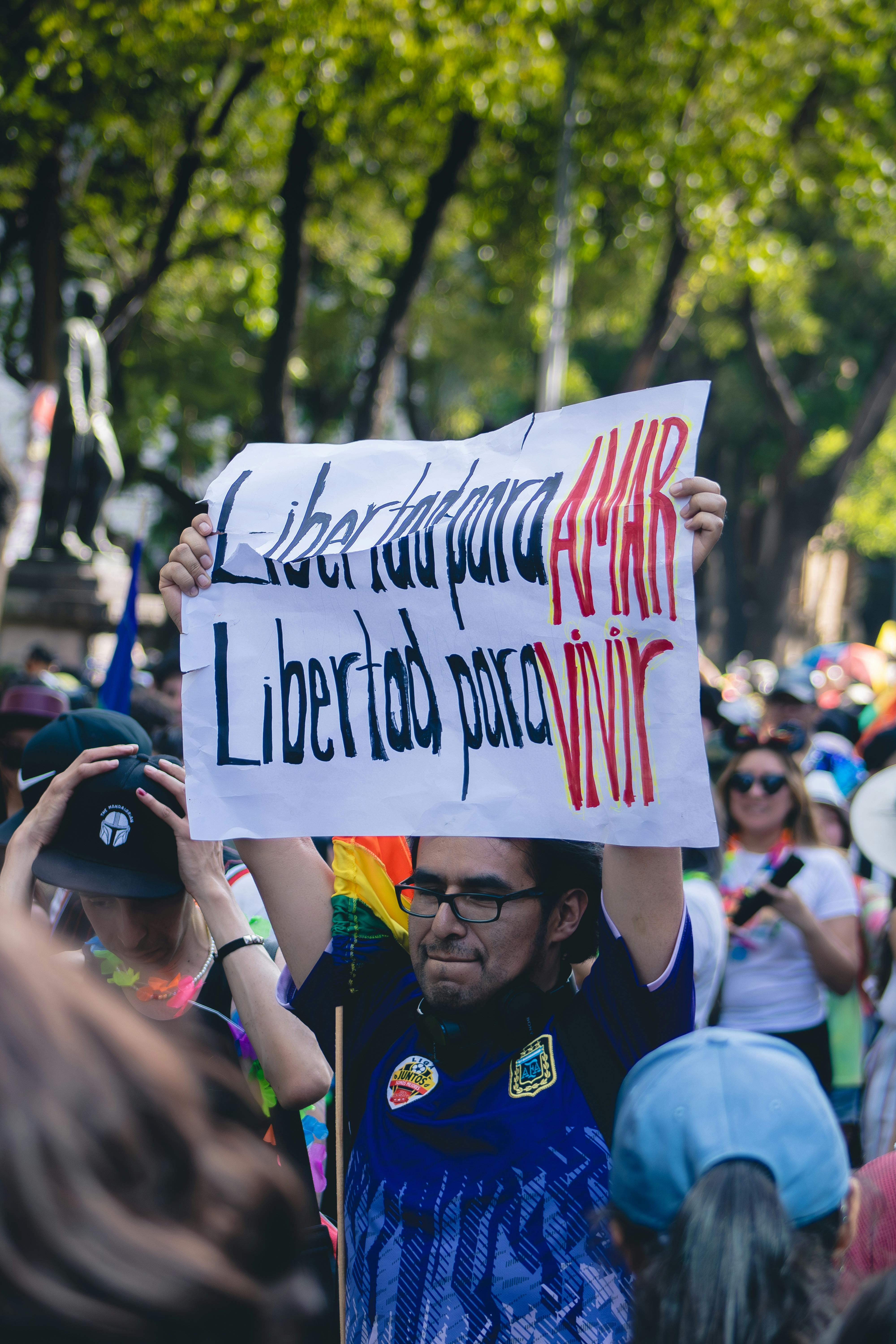 A People Holding a Rainbow Flags · Free Stock Photo