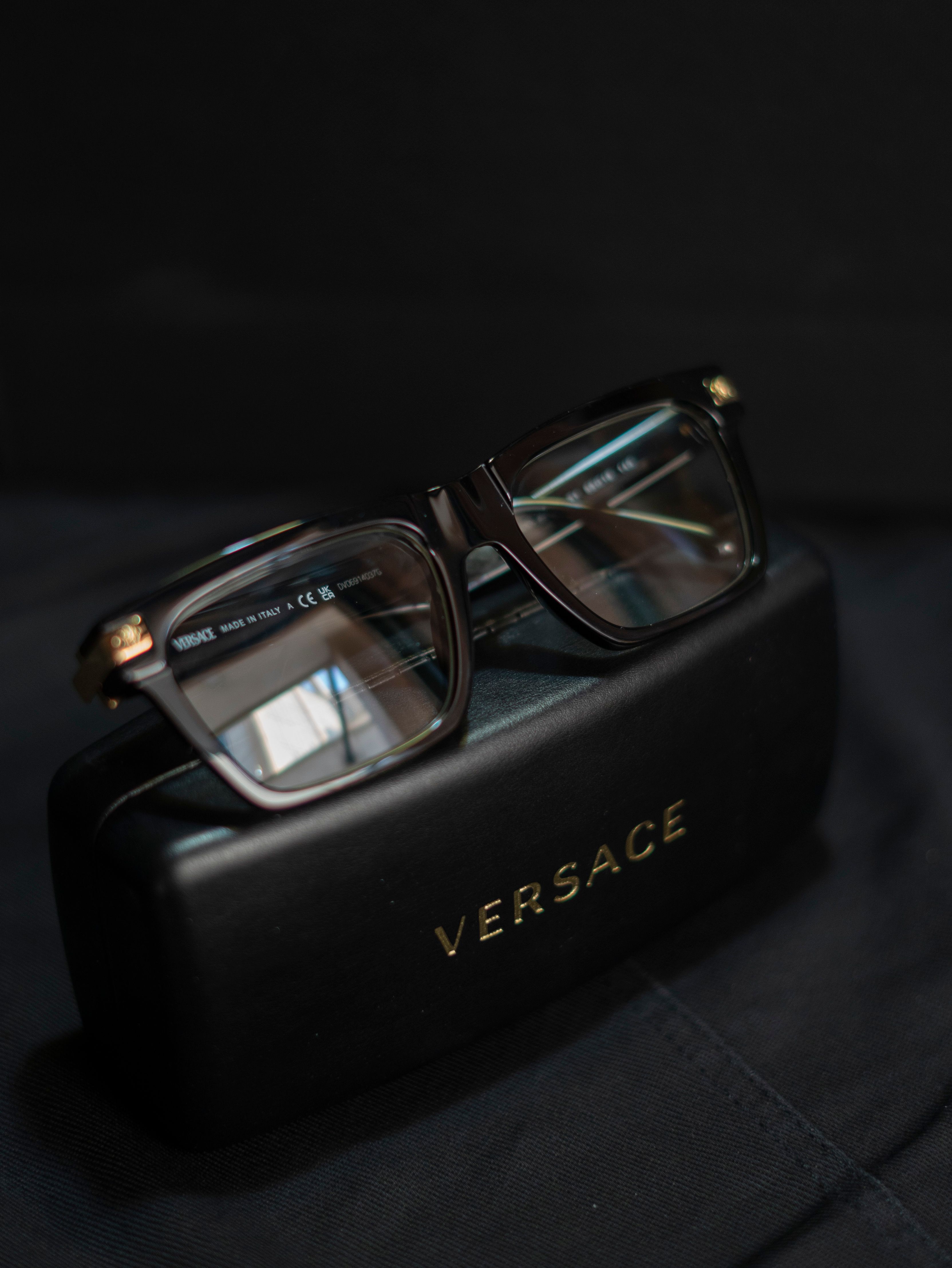 Elegant Versace Eyewear on Display Case · Free Stock Photo